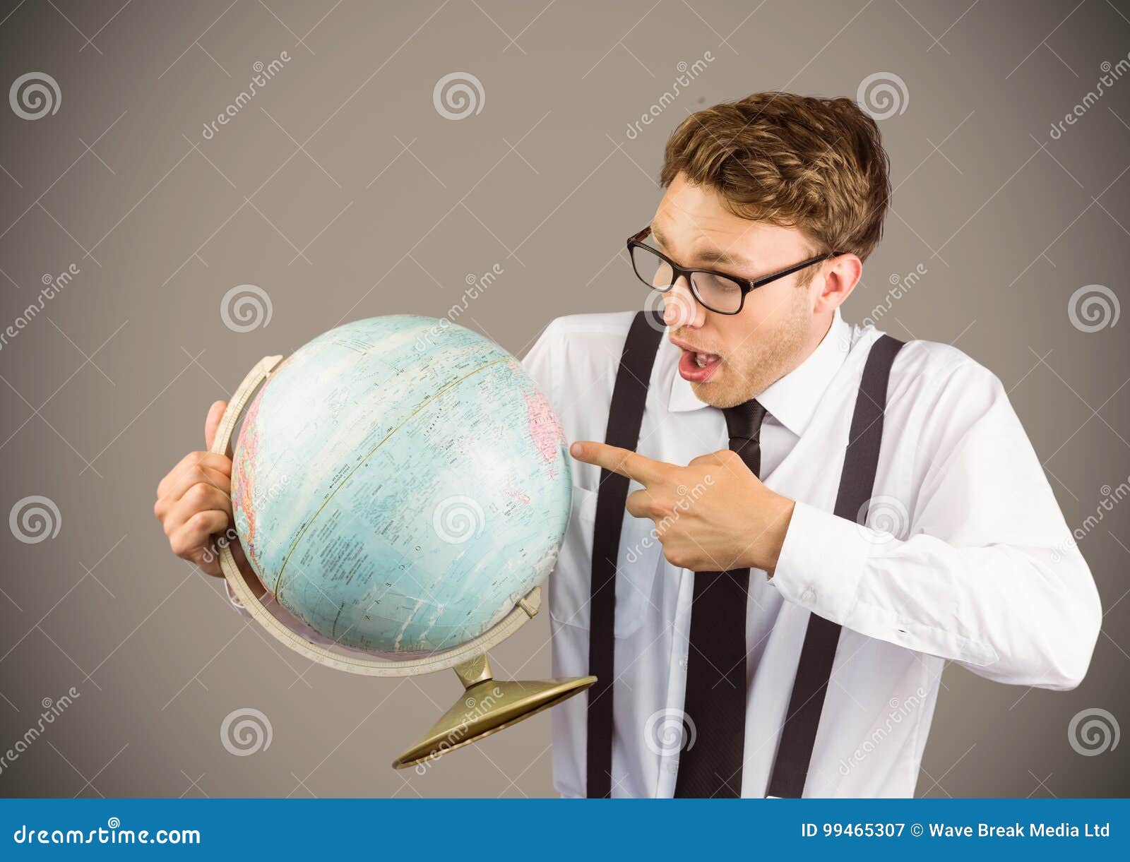 Nerd Man Pointing at Globe Against Brown Background Stock Image - Image ...