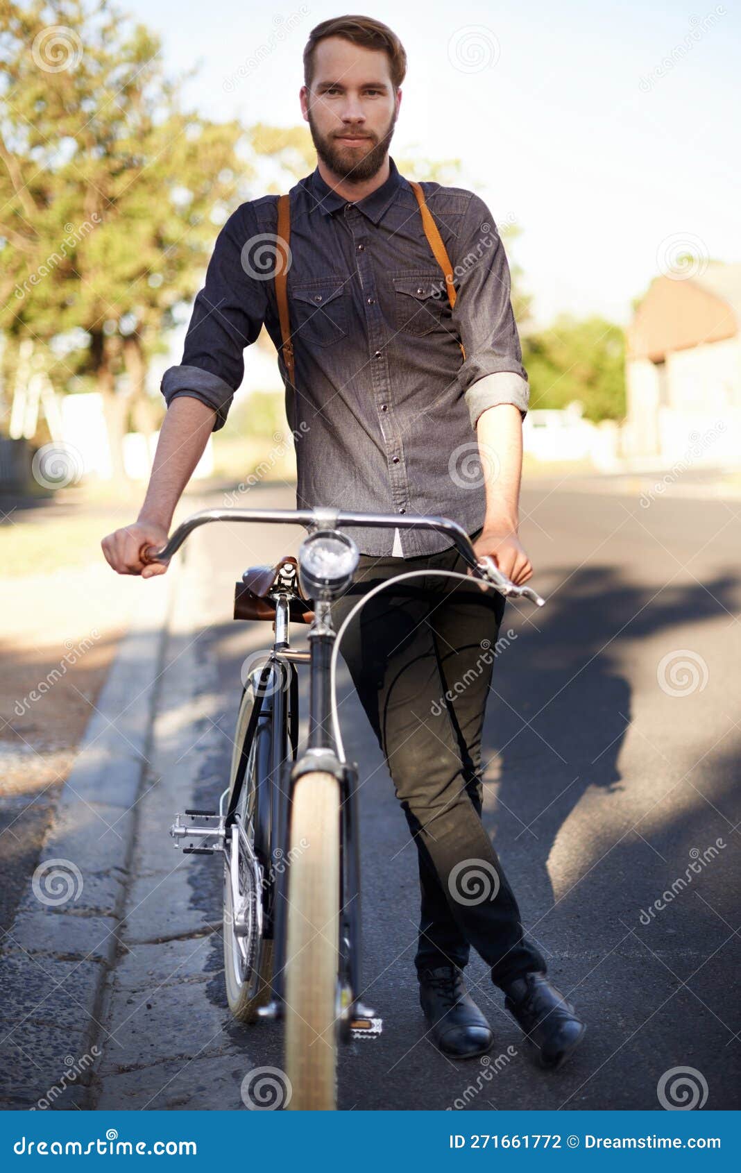 On the Nerd Mover. a Young Man Standing with His Bicycle Outdoors ...