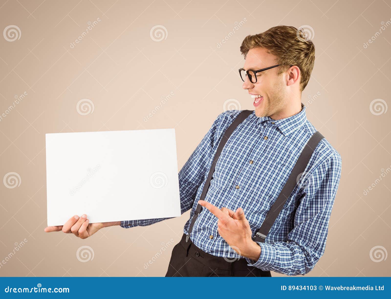 Nerd Pointing at Blank Card Against Cream Background Stock Image ...