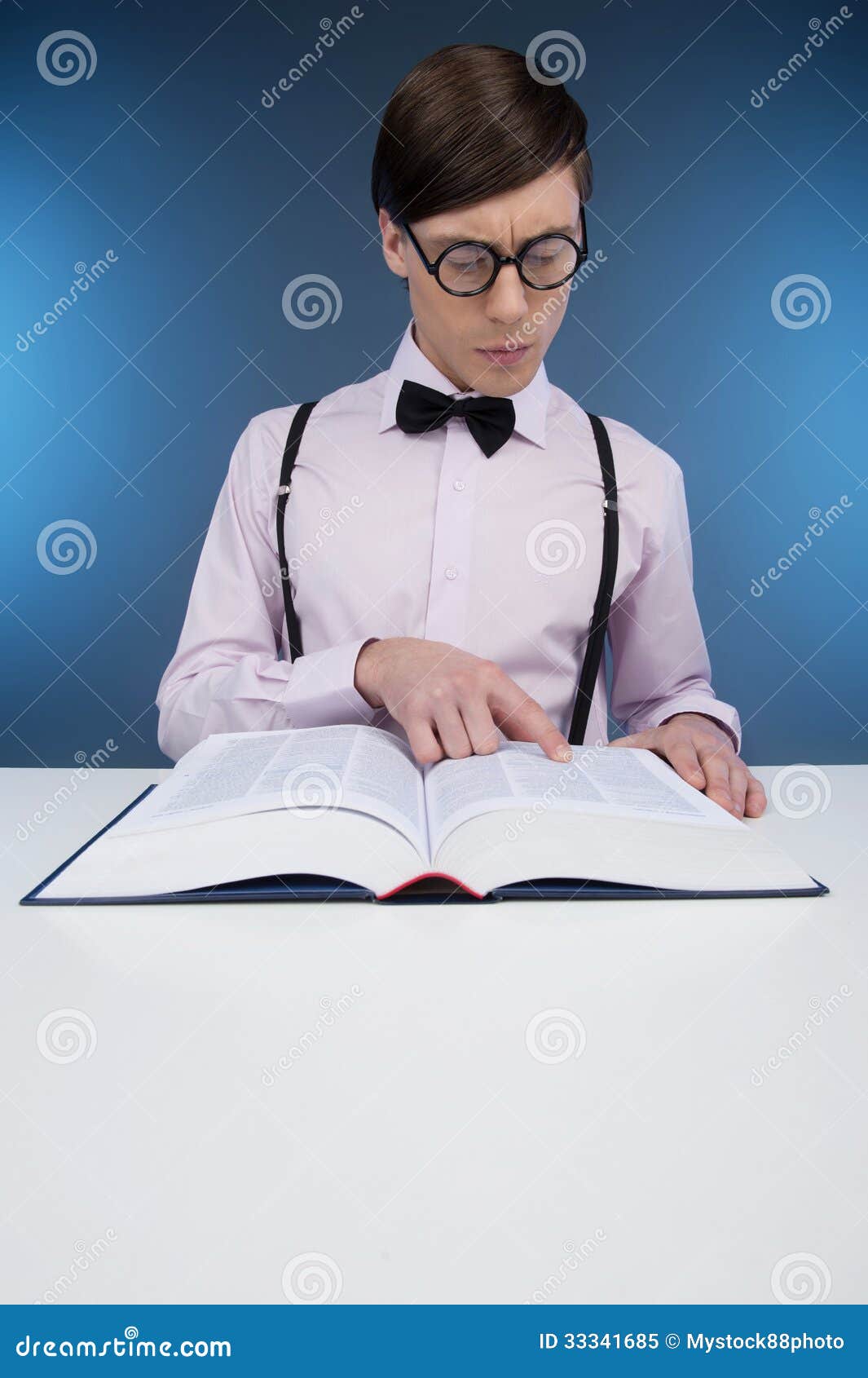 Nerd reading book. stock image. Image of isolated, sitting - 33341685