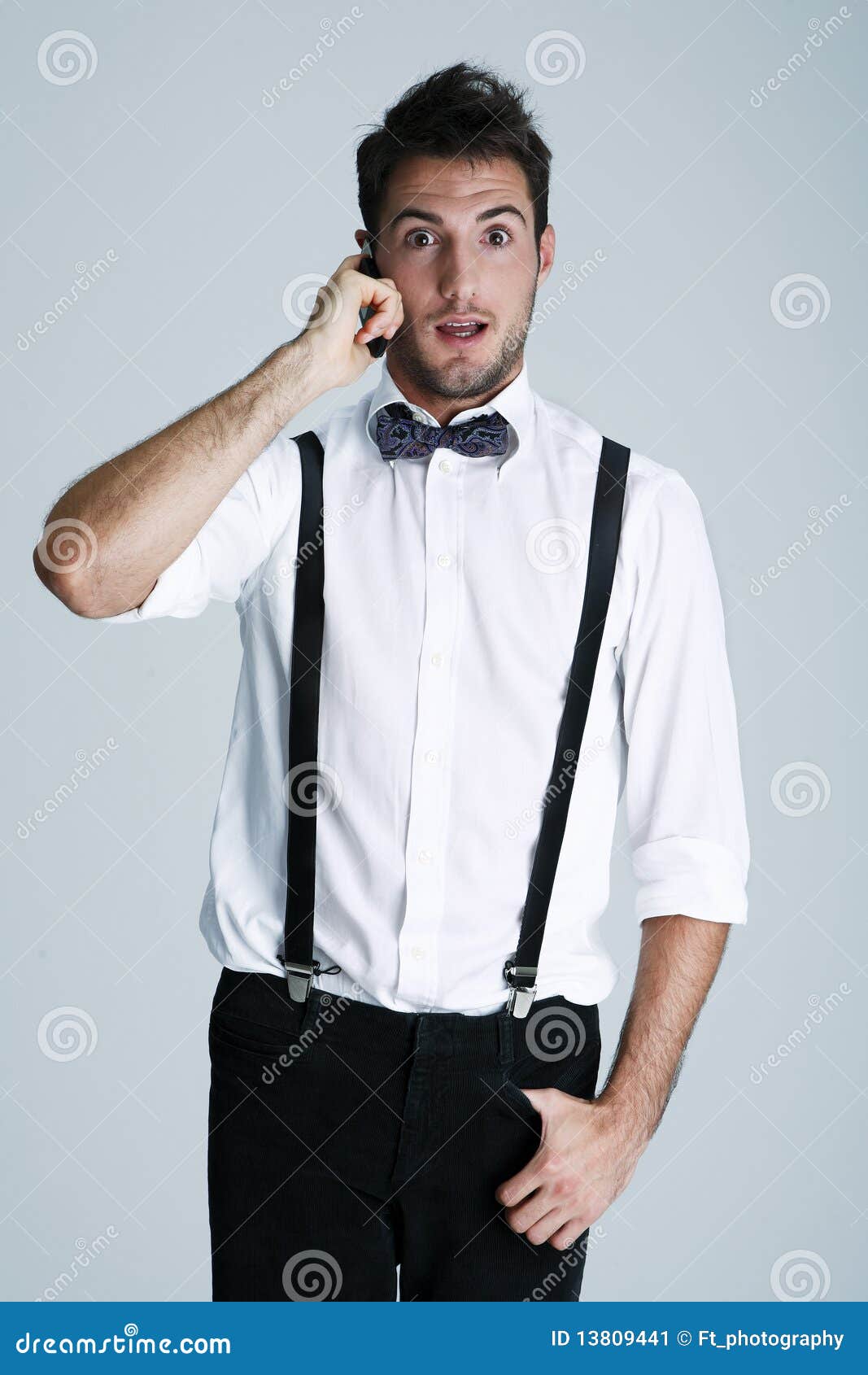 Nerdy Young Man in Suspenders on the Phone Stock Image - Image of front ...