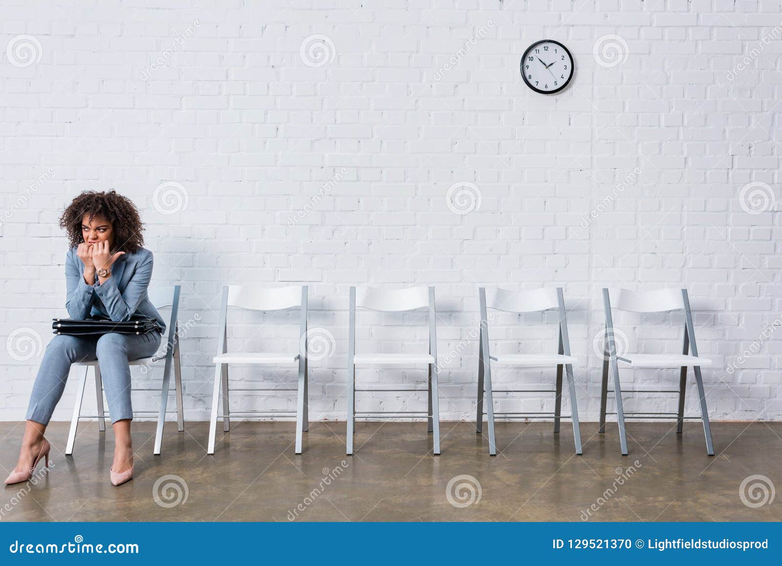 Nervous Female Candidate with Briefcase Waiting Stock Photo - Image of ...