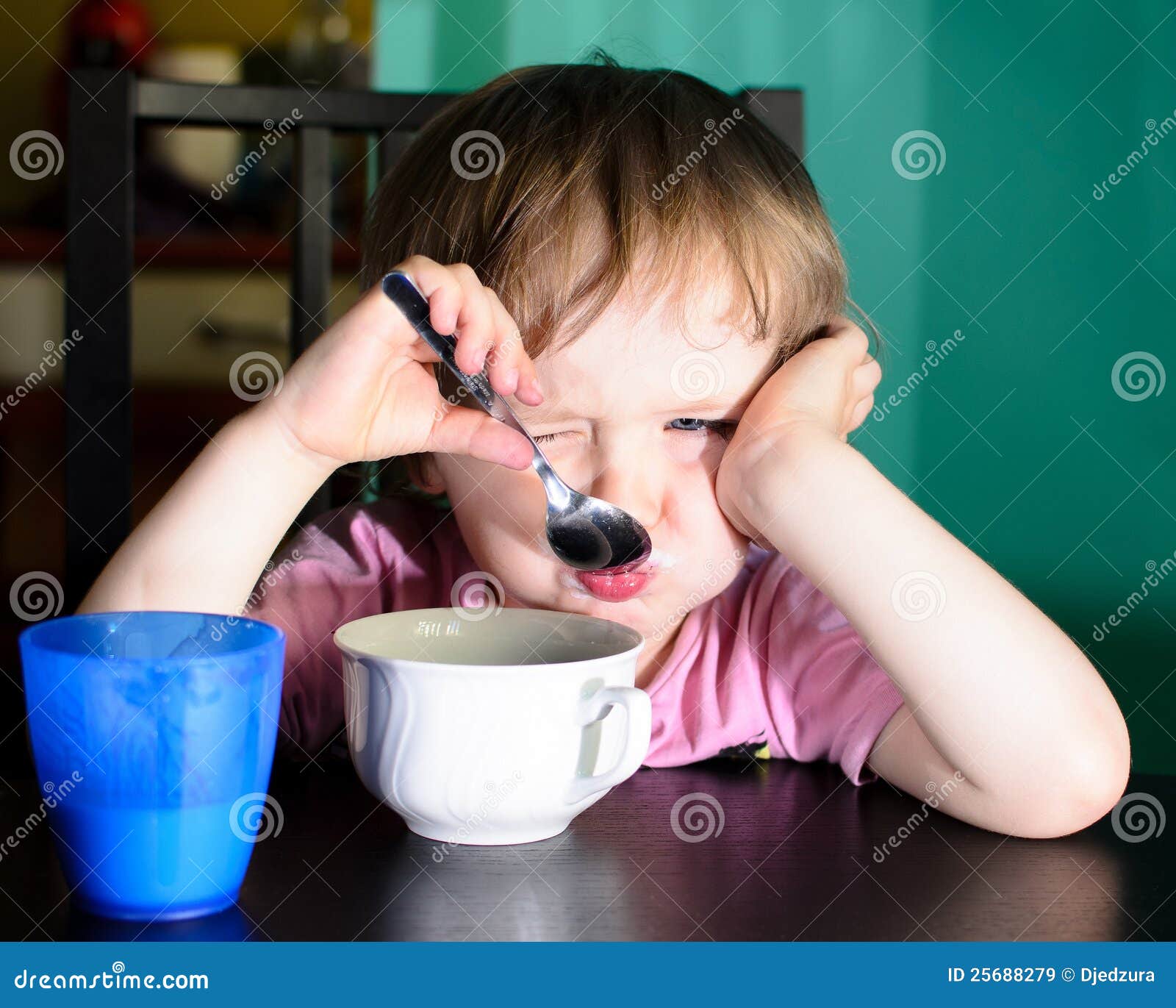 Nervous little boy eating stock image. Image of dinner - 25688279