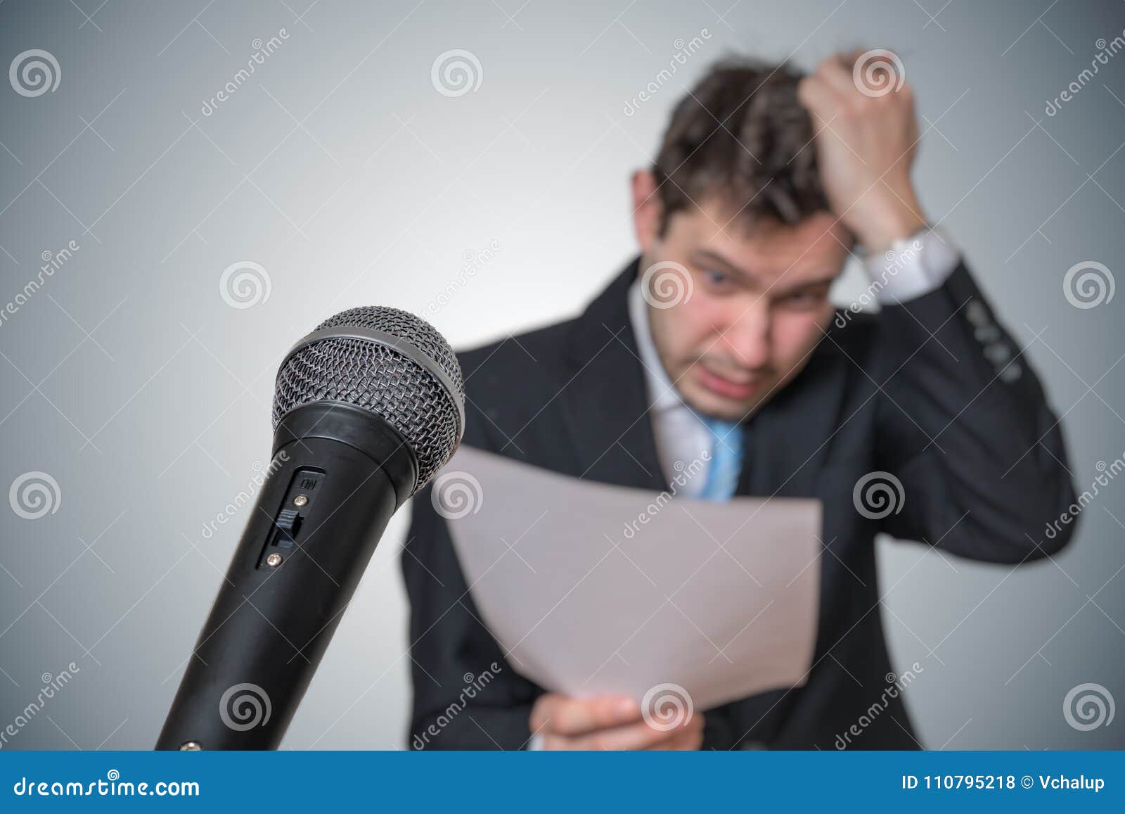 Nervous Man is Afraid of Public Speech and Sweating. Microphone in ...