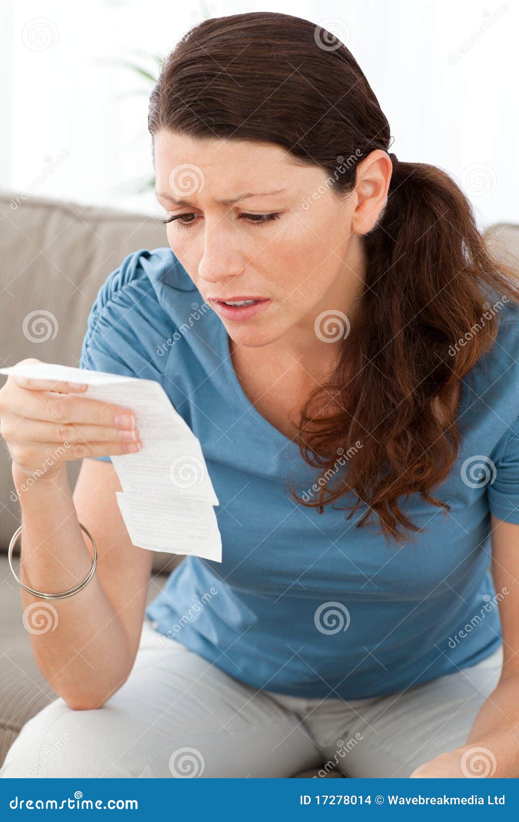 Nervous Woman Looking at a Bill Stock Photo - Image of desperate, house ...