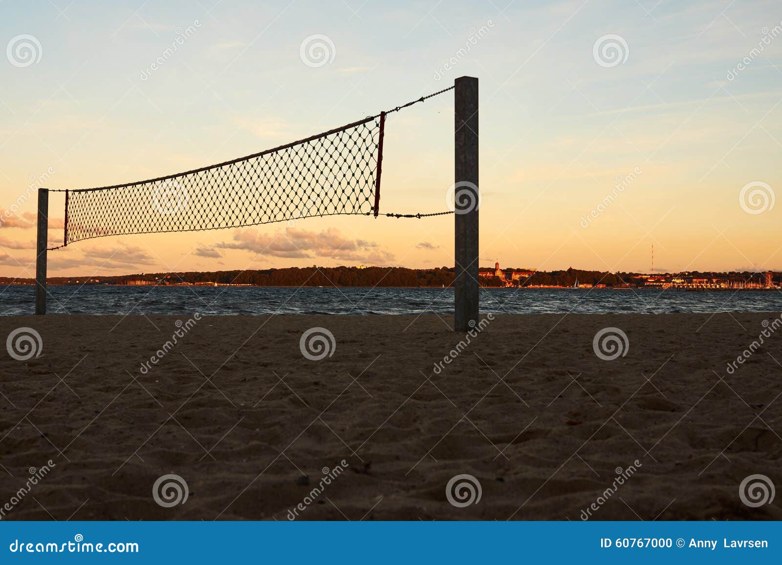 Net at the beach at sunset stock photo. Image of water - 60767000