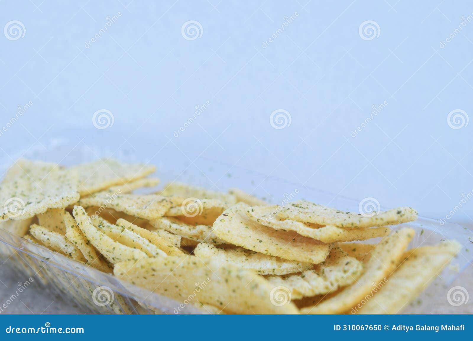 Net Chips in a Plastic Container that Tastes Good Stock Photo - Image ...