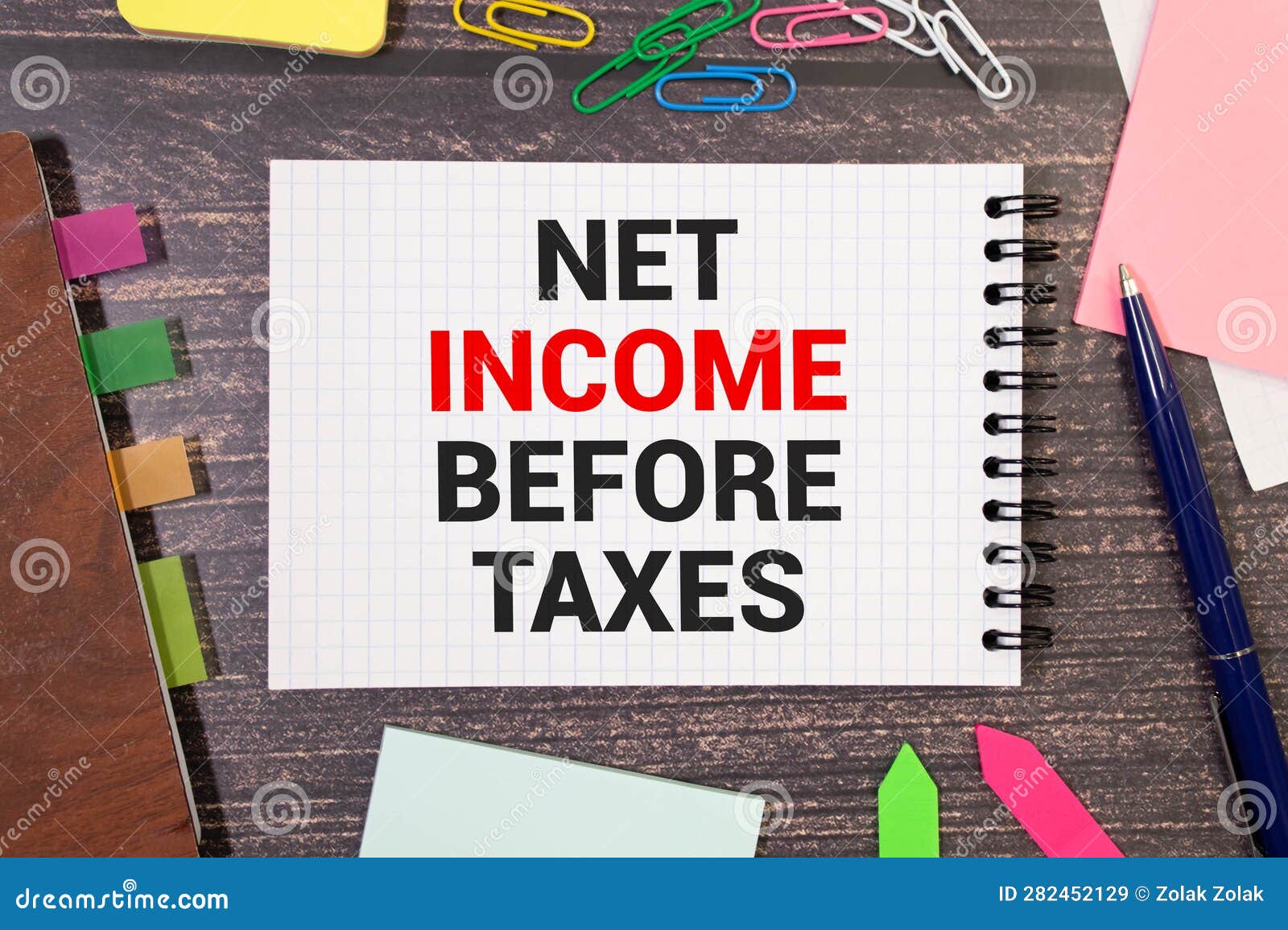 Net Income before Taxes, Text on White Paper on Torn Paper Background ...