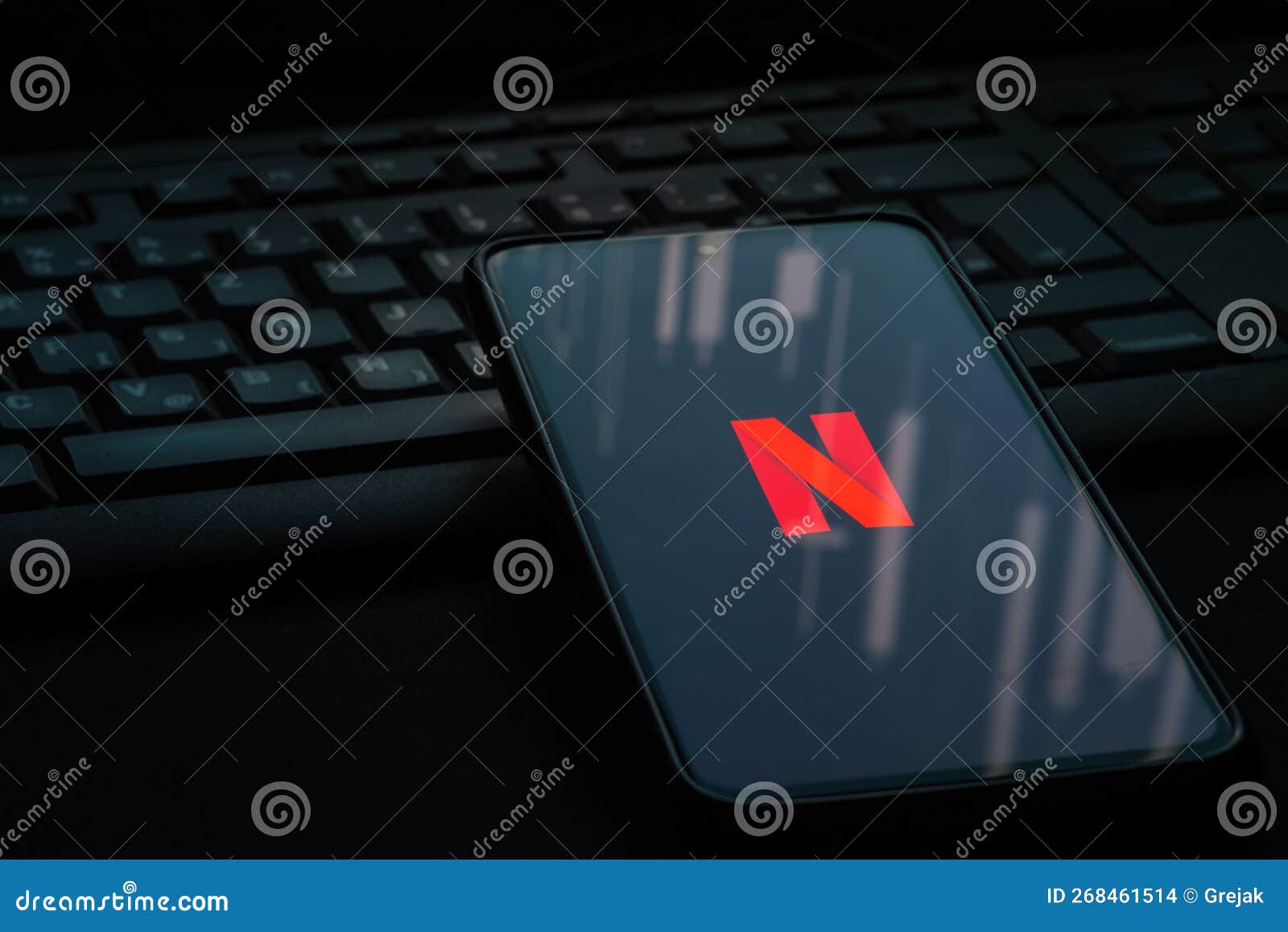Netflix Logo on Smartphone Screen Laying on Computer Keyboard Editorial ...