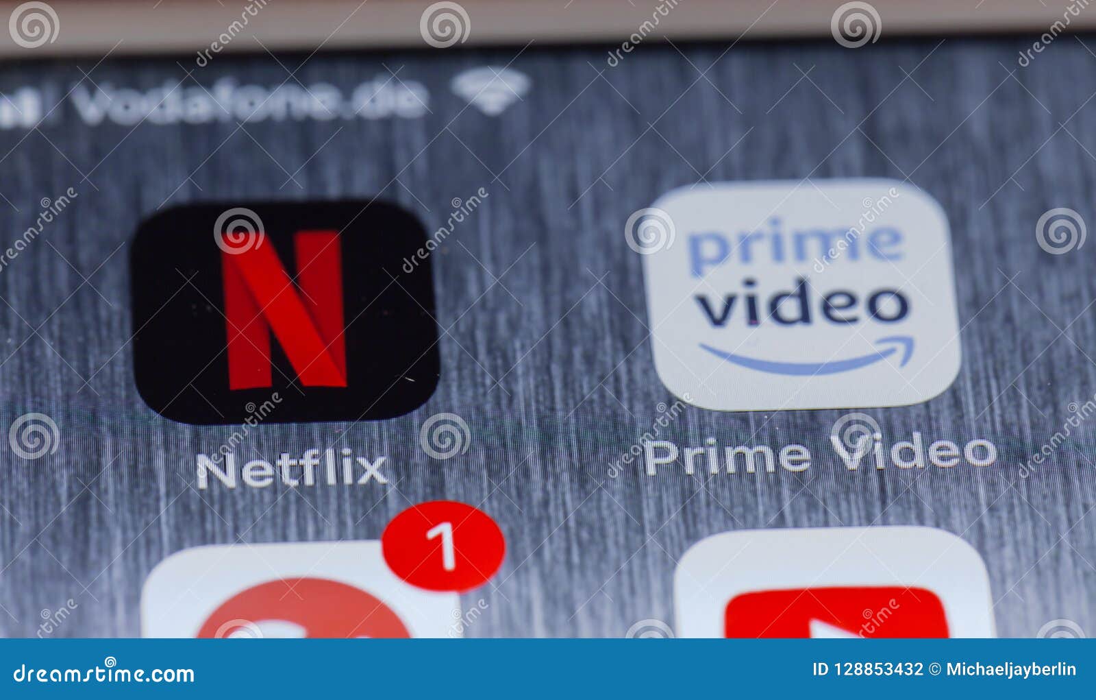 Netflix and Prime Video Apps on Broken IPhone Screen Editorial ...