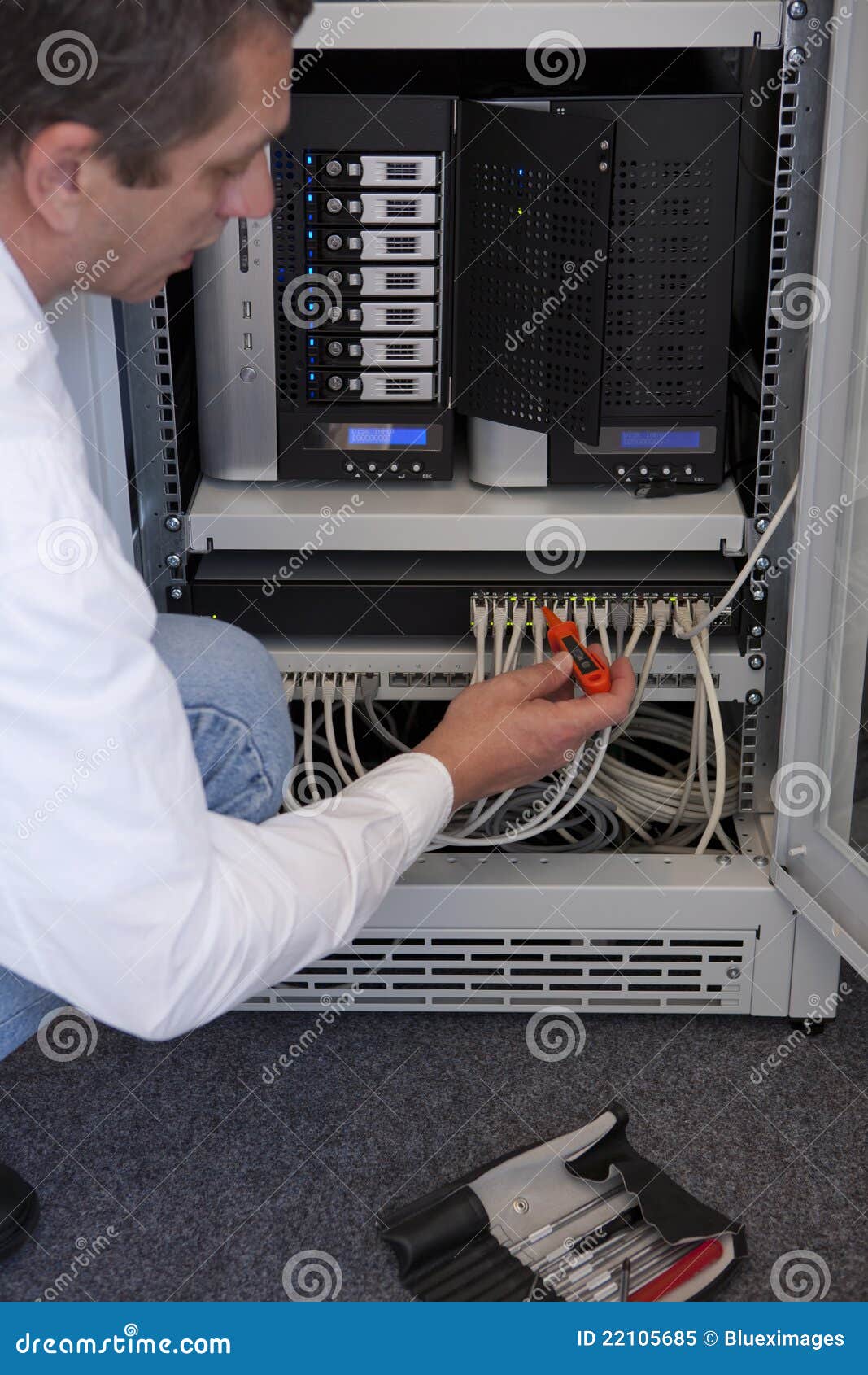 Network Administrator Holding Laptop In Hand Working Configuration With ...