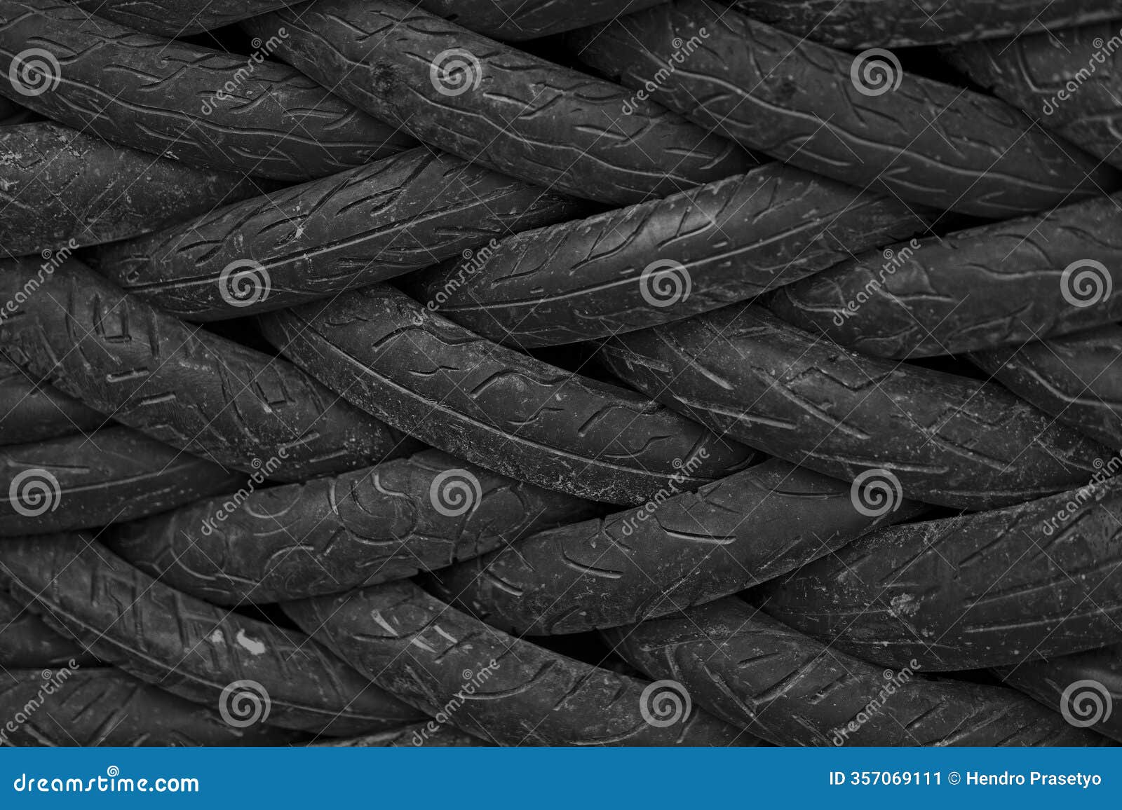 A Network of Black and White Used Tires, Carefully Interwoven, Forms a ...