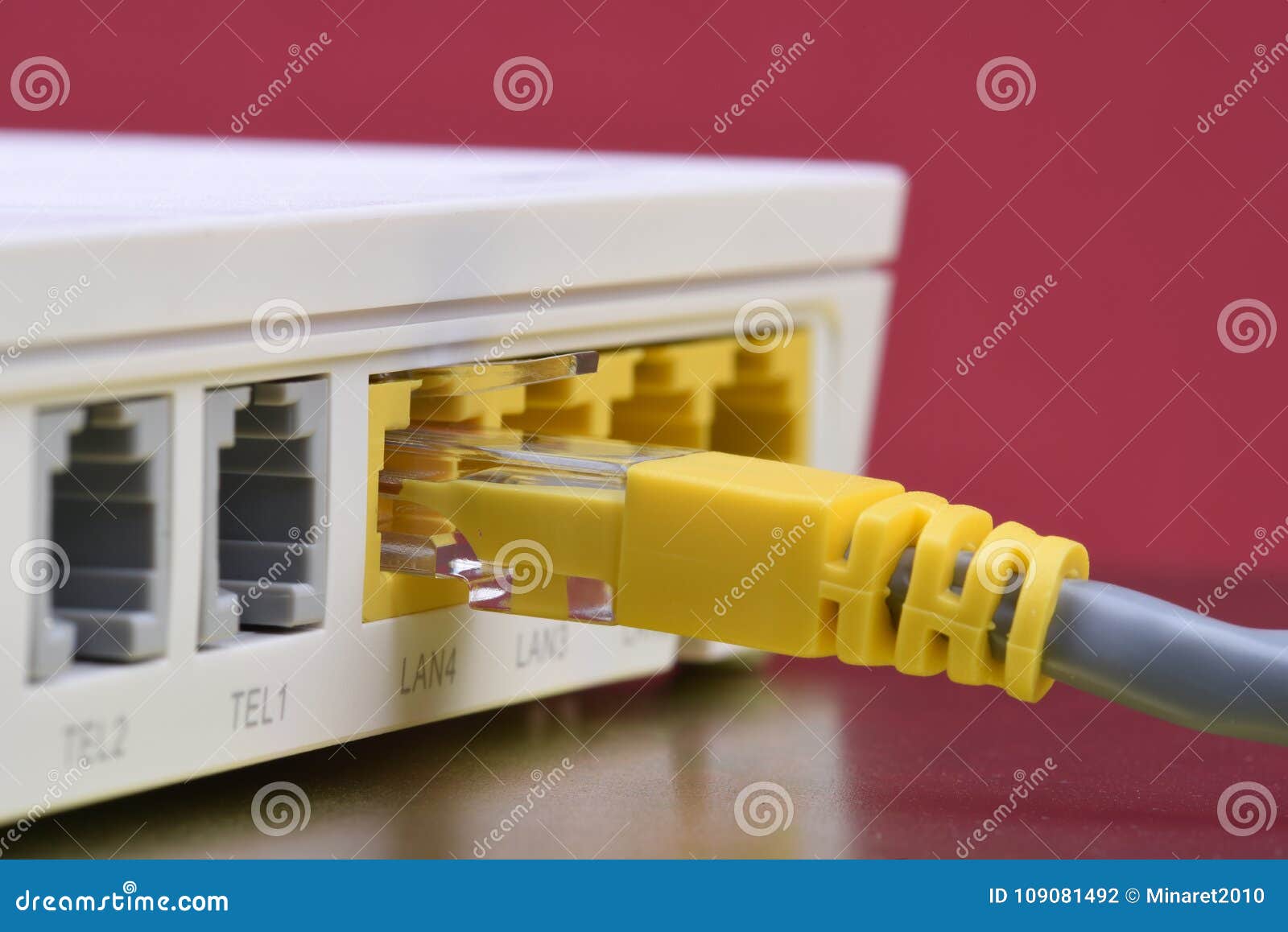 Network Cable Connected To Internet Router on Metal Table Stock Photo ...