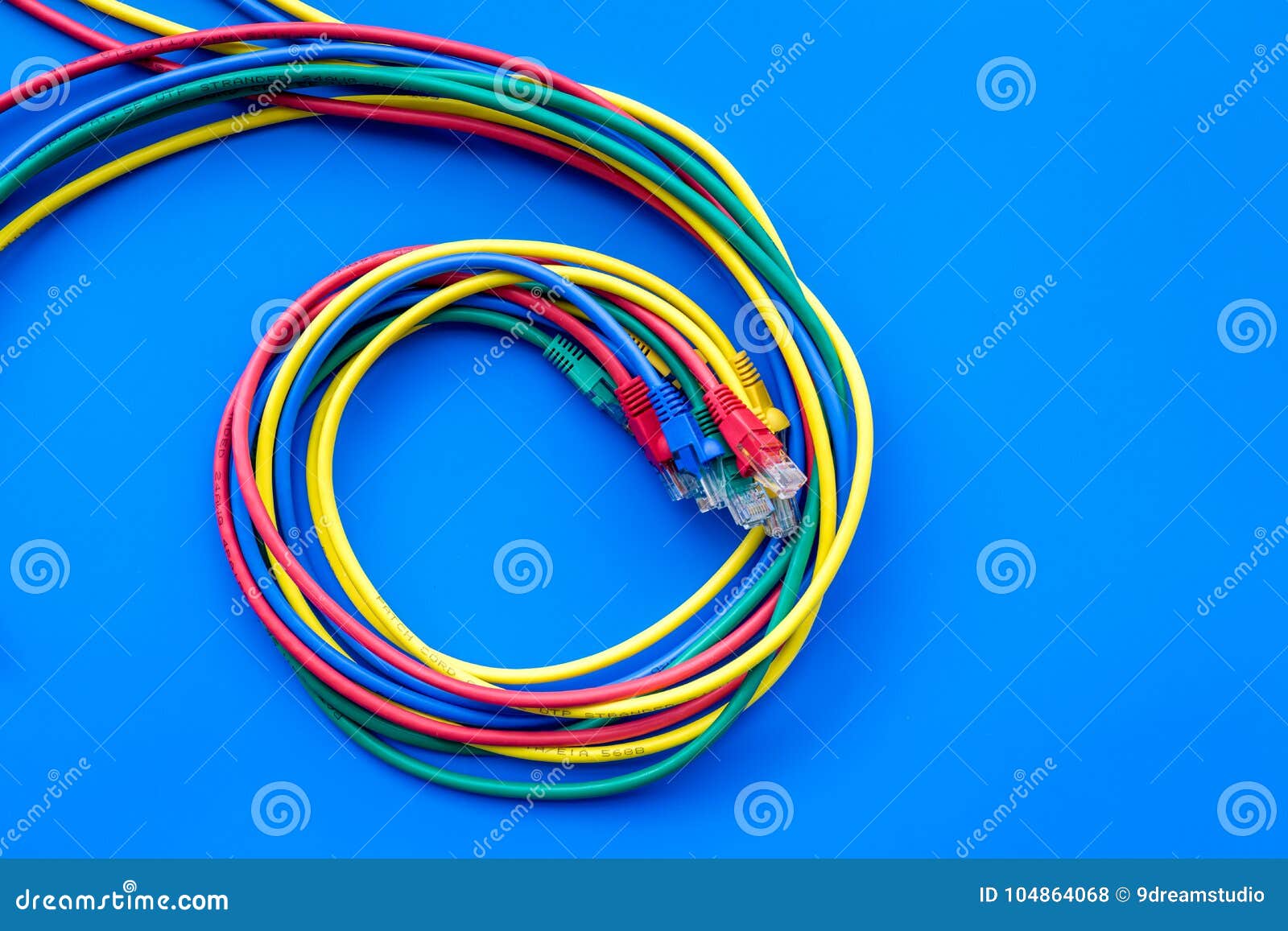 Network Colored Cables for Computer on Blue Background Top View ...