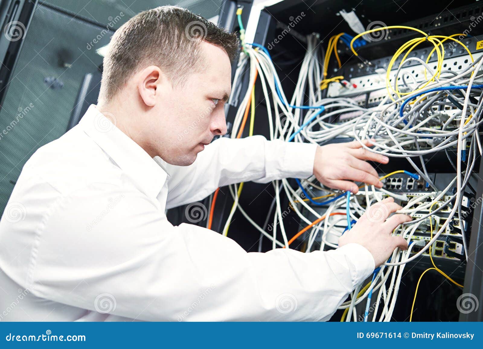 Network Engineer Administrating in Server Room Stock Photo - Image of ...