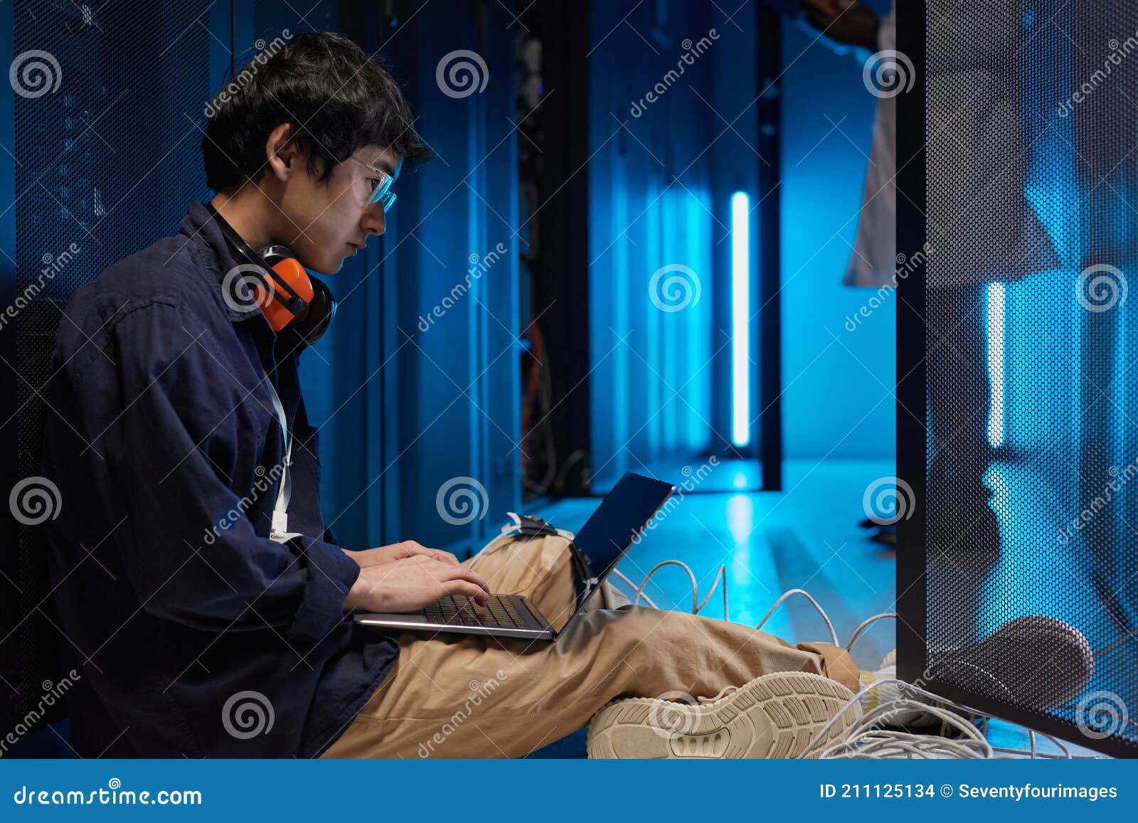 Network Engineer in Server Room Stock Photo - Image of sitting, server ...