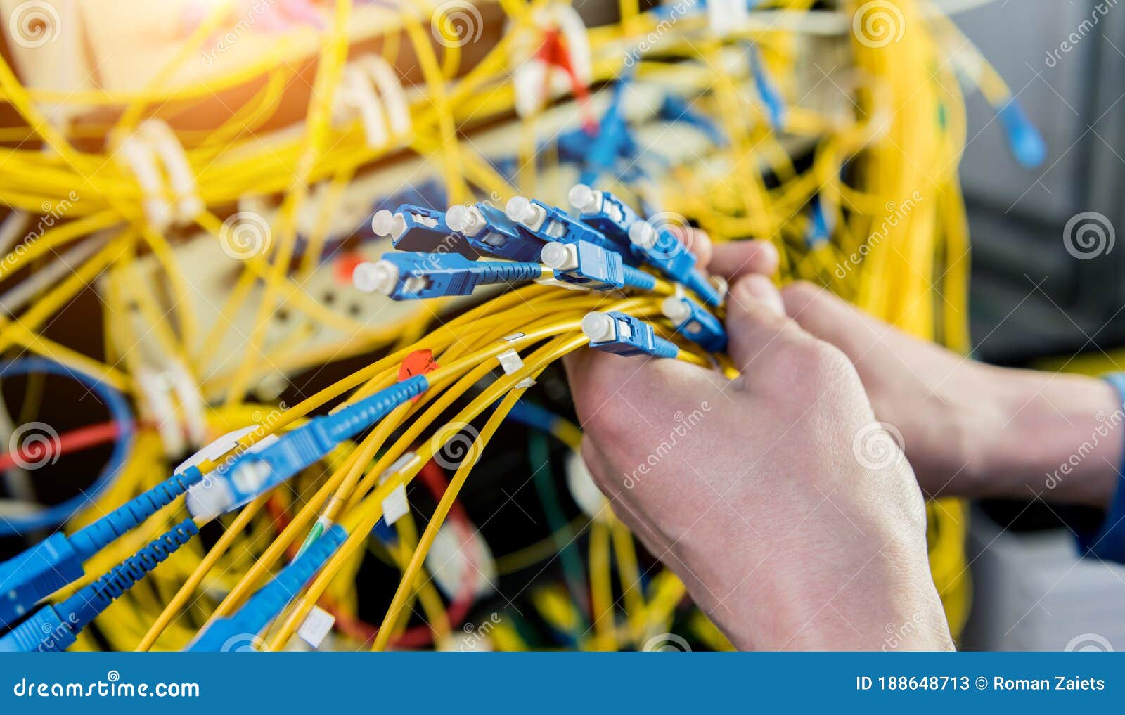 Network Engineer Working in Server Room. Connecting Network Cables To ... Network Engineer Working in Server Room. Connecting Network Cables To ...