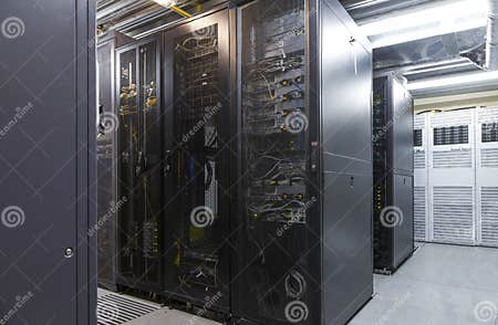 Network Server Room with Parallel Rows of Mainframe. Corridor in Big ...