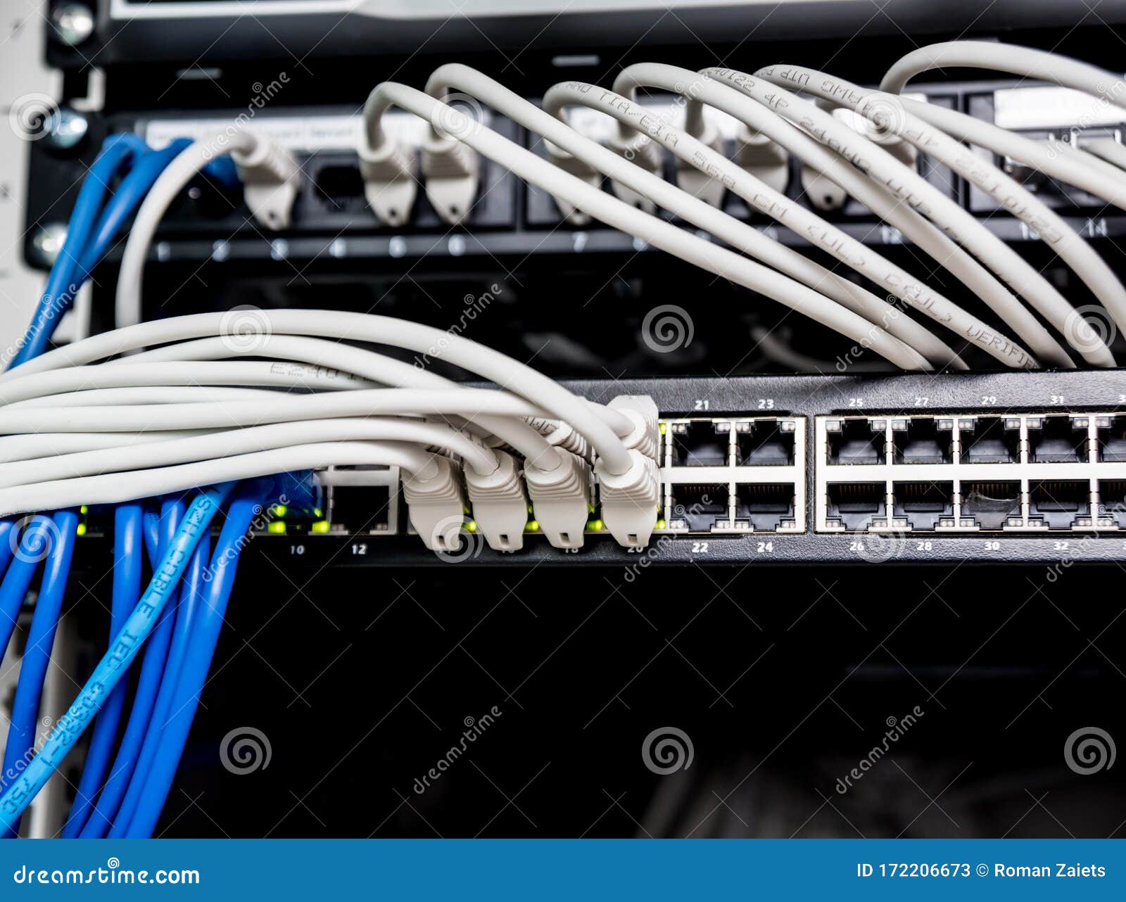 Network Switch and Ethernet Cables in Red and White Colors. Data Center ...