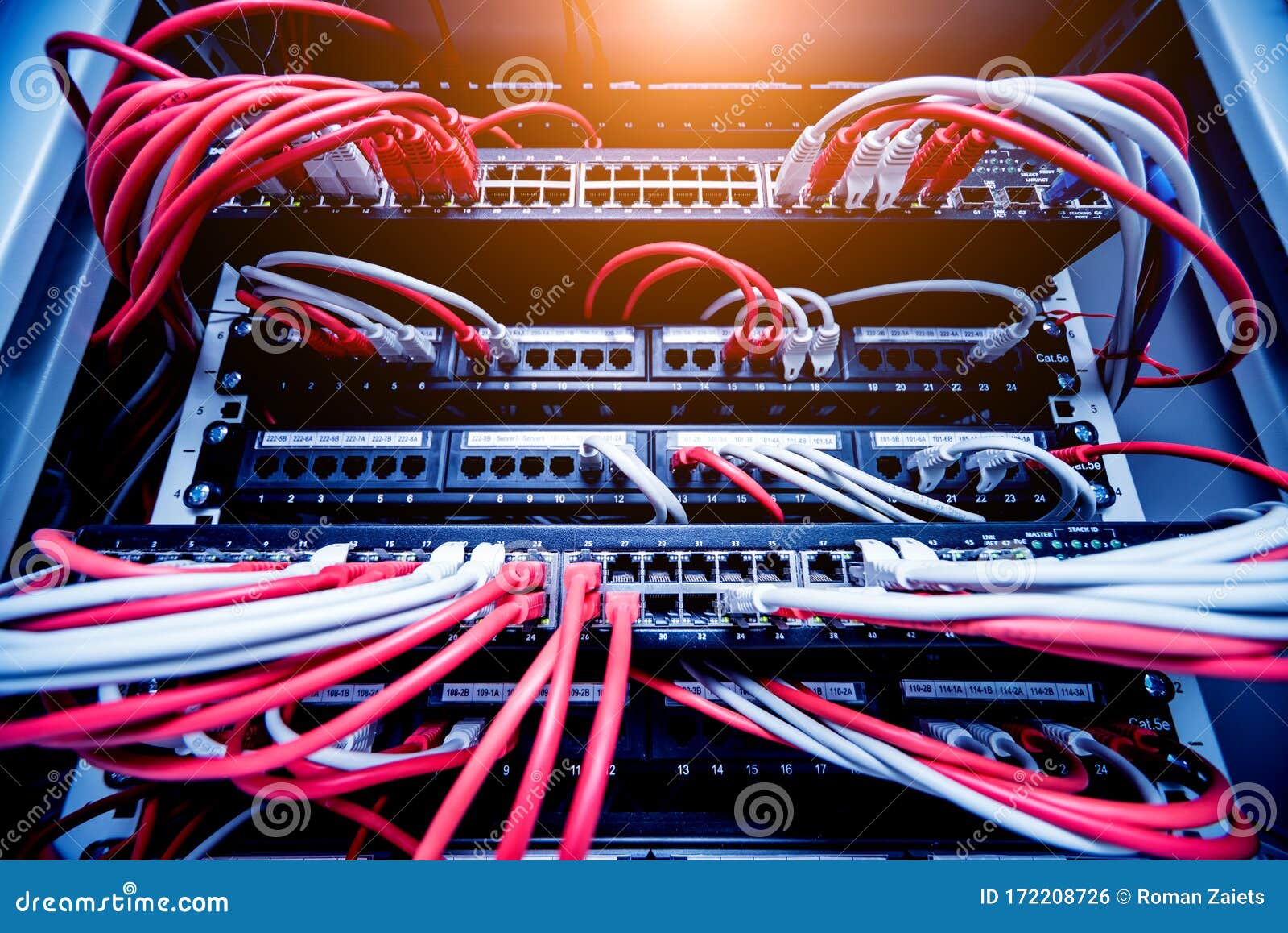 Network Switch and Ethernet Cables in Red and White Colors. Data Center ...