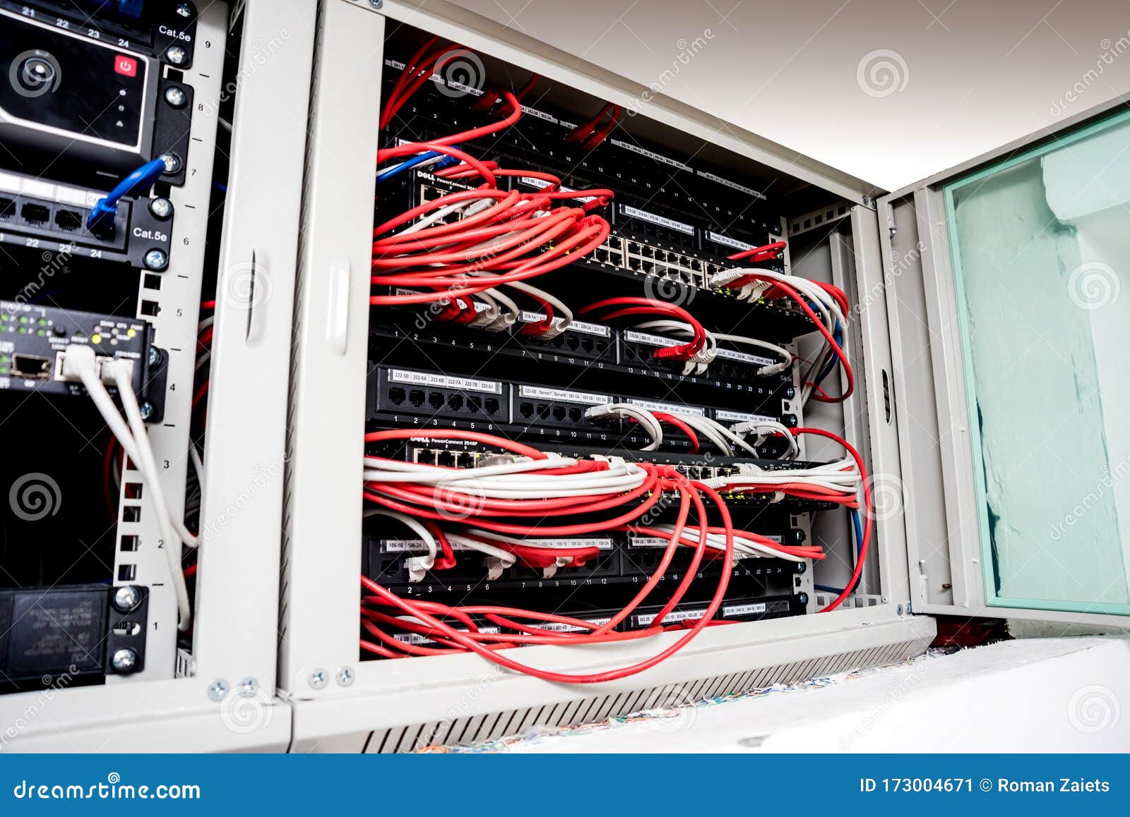 Network Switch and Ethernet Cables in Red and White Colors. Data Center ...
