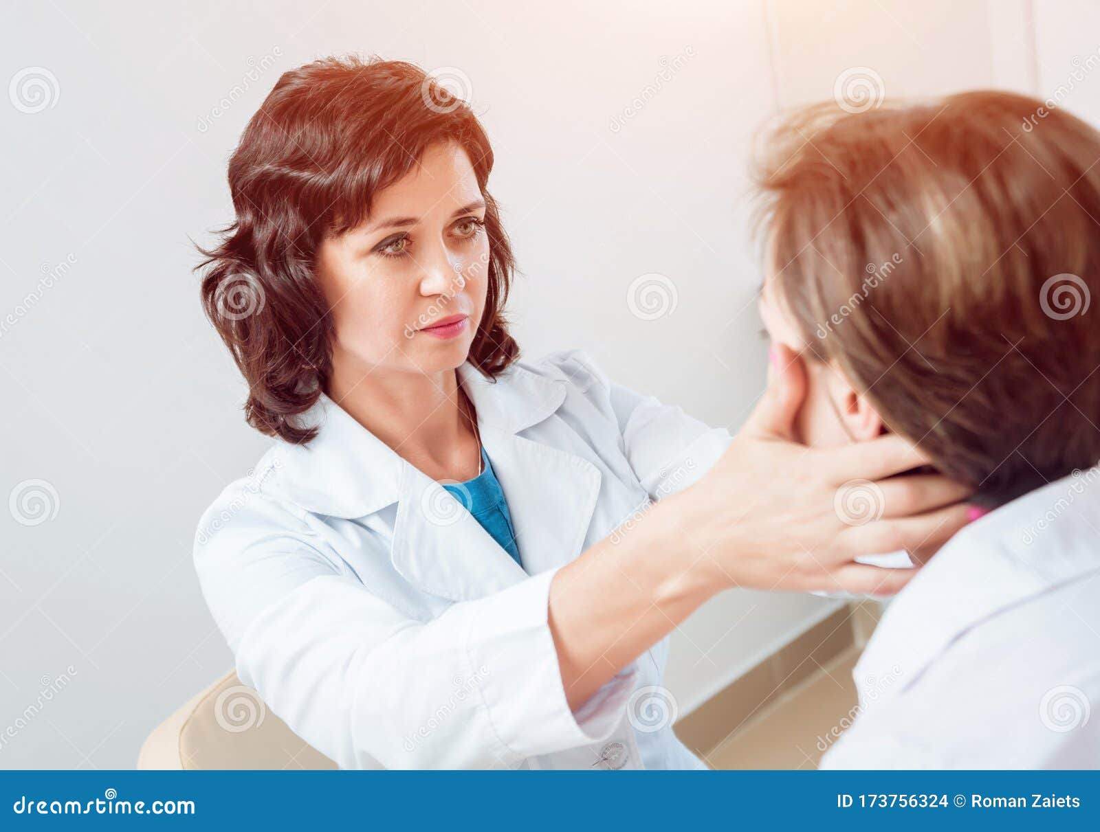 Neurological Examination The Neurologist Testing Hand Reflexes On A