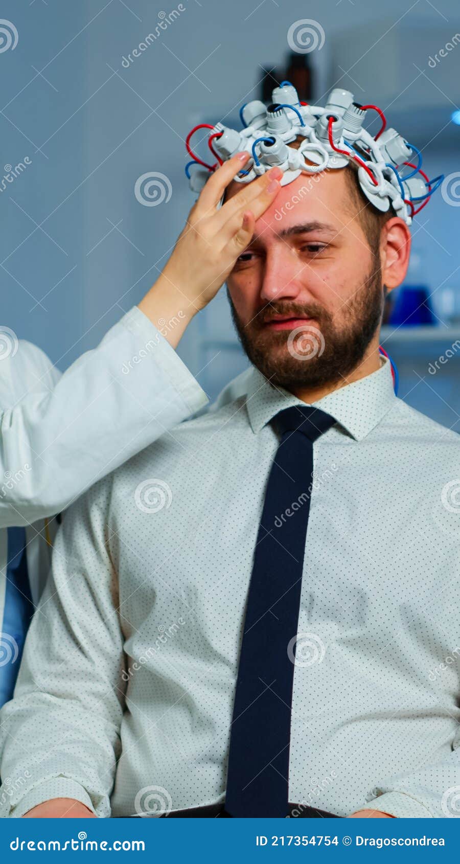 Neurologist Doctor Analysing Brain of Man Using Brainwave Scanning ...