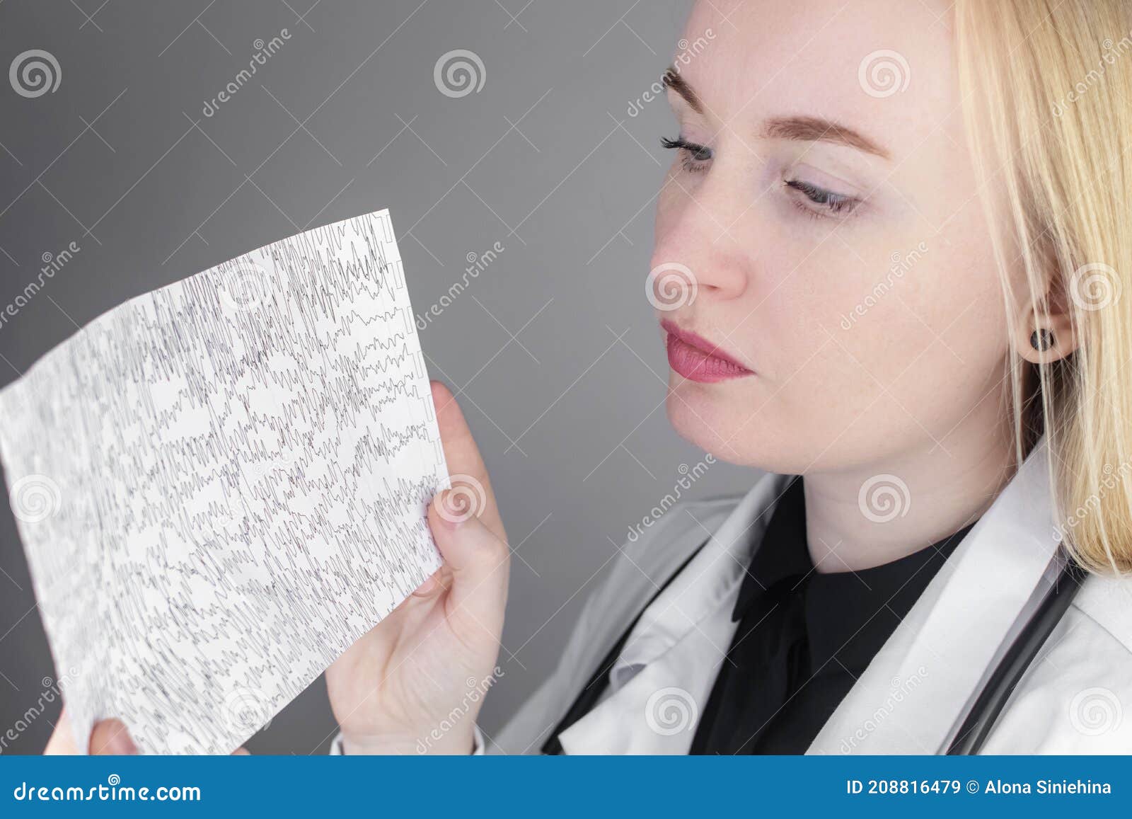 A Neurologist Examines an Encephalogram of a Patientâ€™s Brain ...