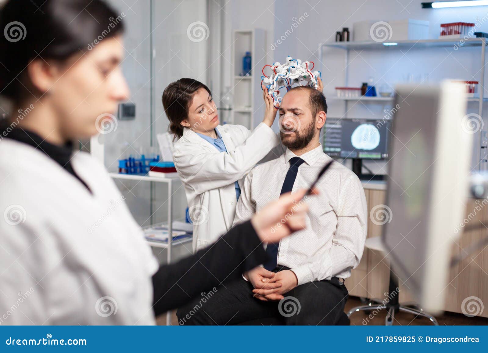 Neurology Researcher Adjusting Brain Headset on Patient during Study ...