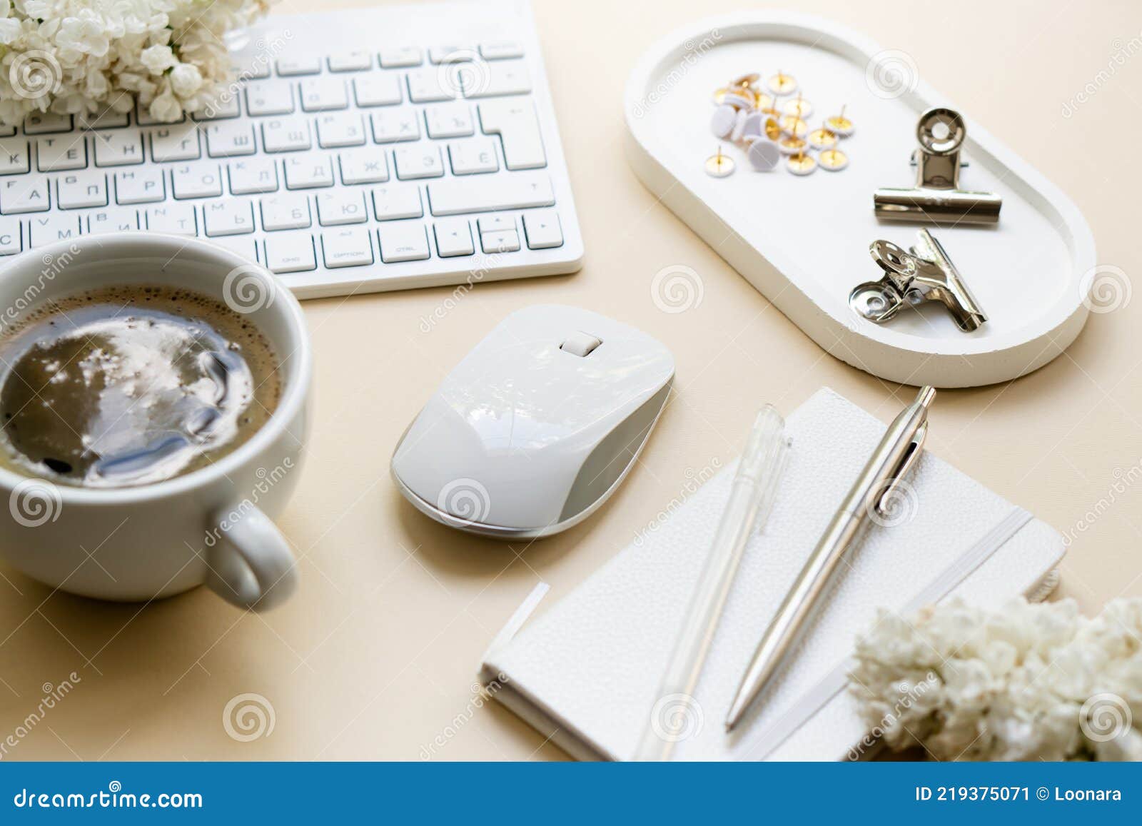 Neutral Color Tabletop with Pc Keyboard, Notepad and White Flowers ...