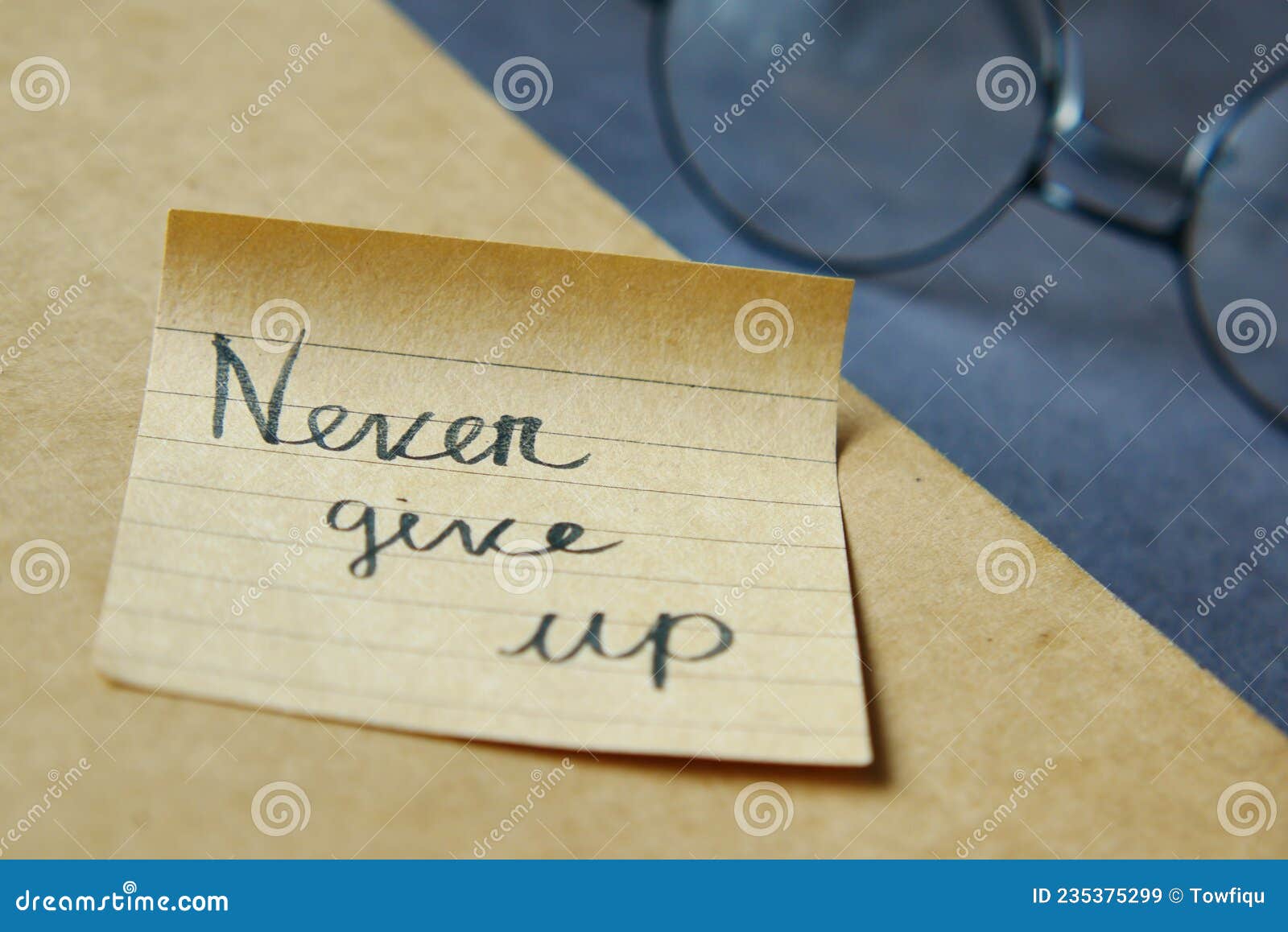Never Give Up Word on Stick Note on Table , Stock Image - Image of ...
