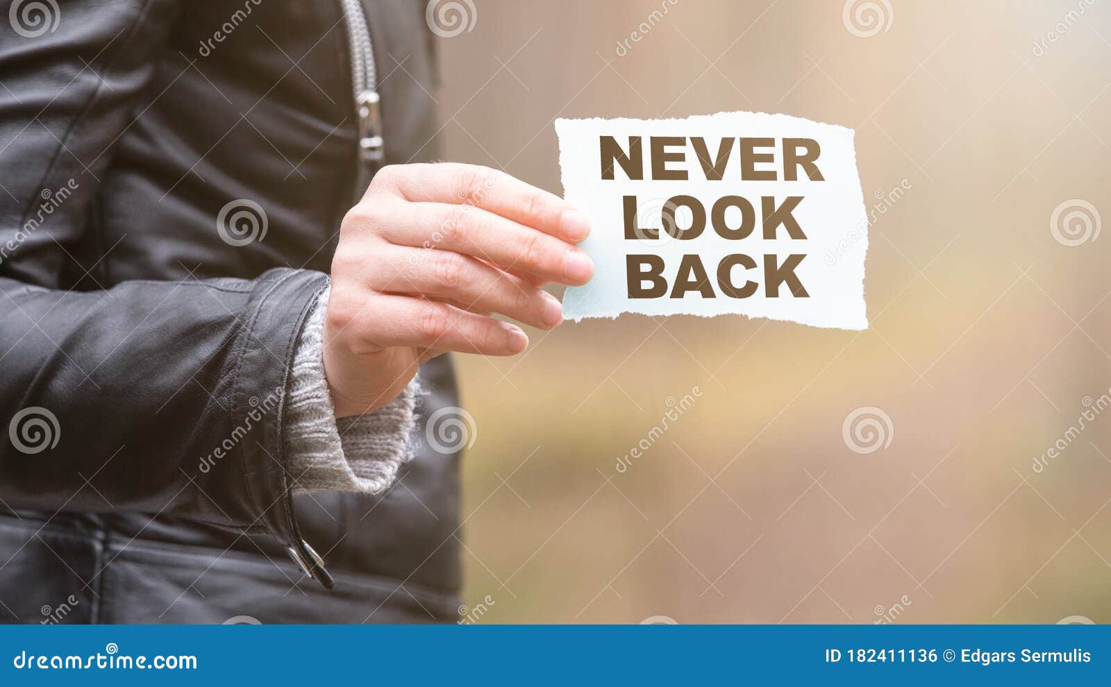 NEVER LOOK BACK Concept. Text on the Sheet in Hand Stock Photo - Image ...