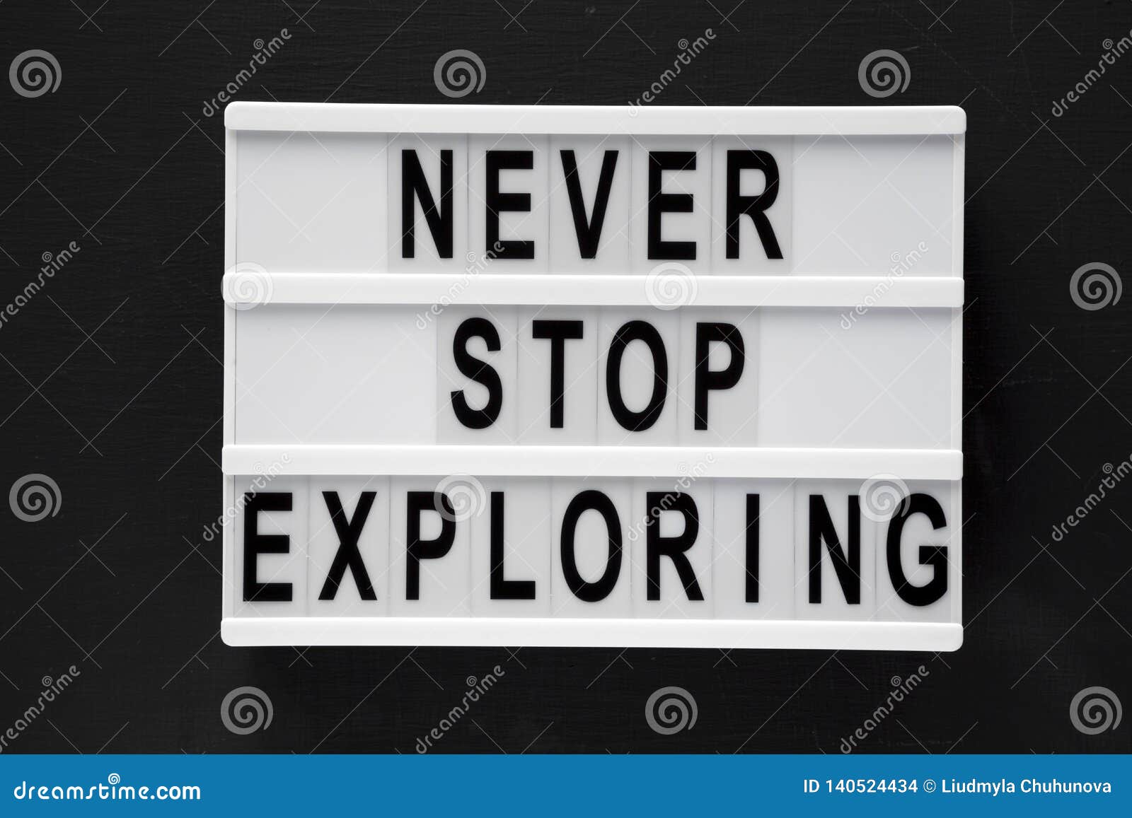 `Never Stop Exploring` Word on Modern Board Over Black Surface, Top ...