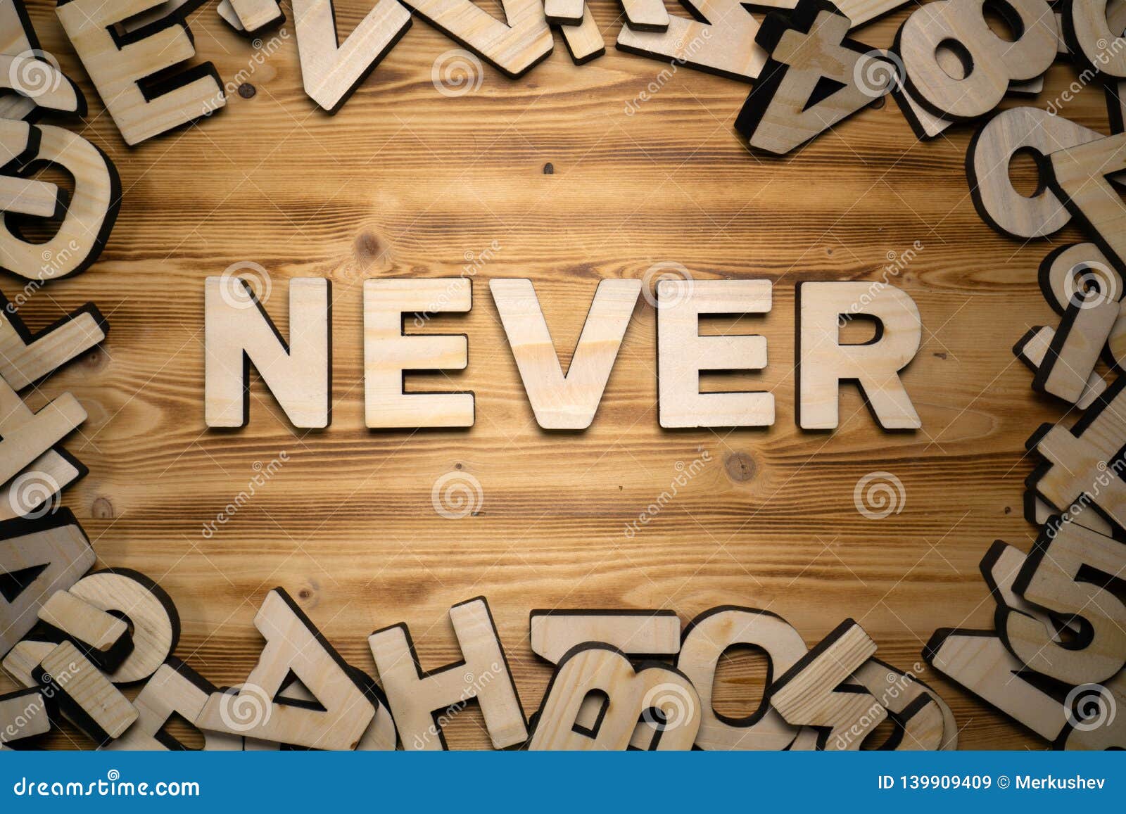 NEVER Word Made With Block Letters Lying On Wooden Board Royalty-Free ...