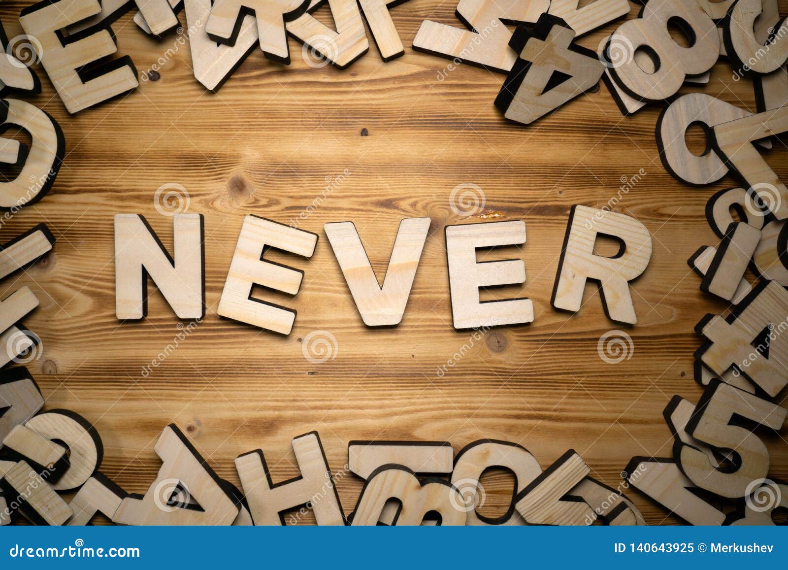 NEVER Word Made With Block Letters Lying On Wooden Board Royalty-Free ...