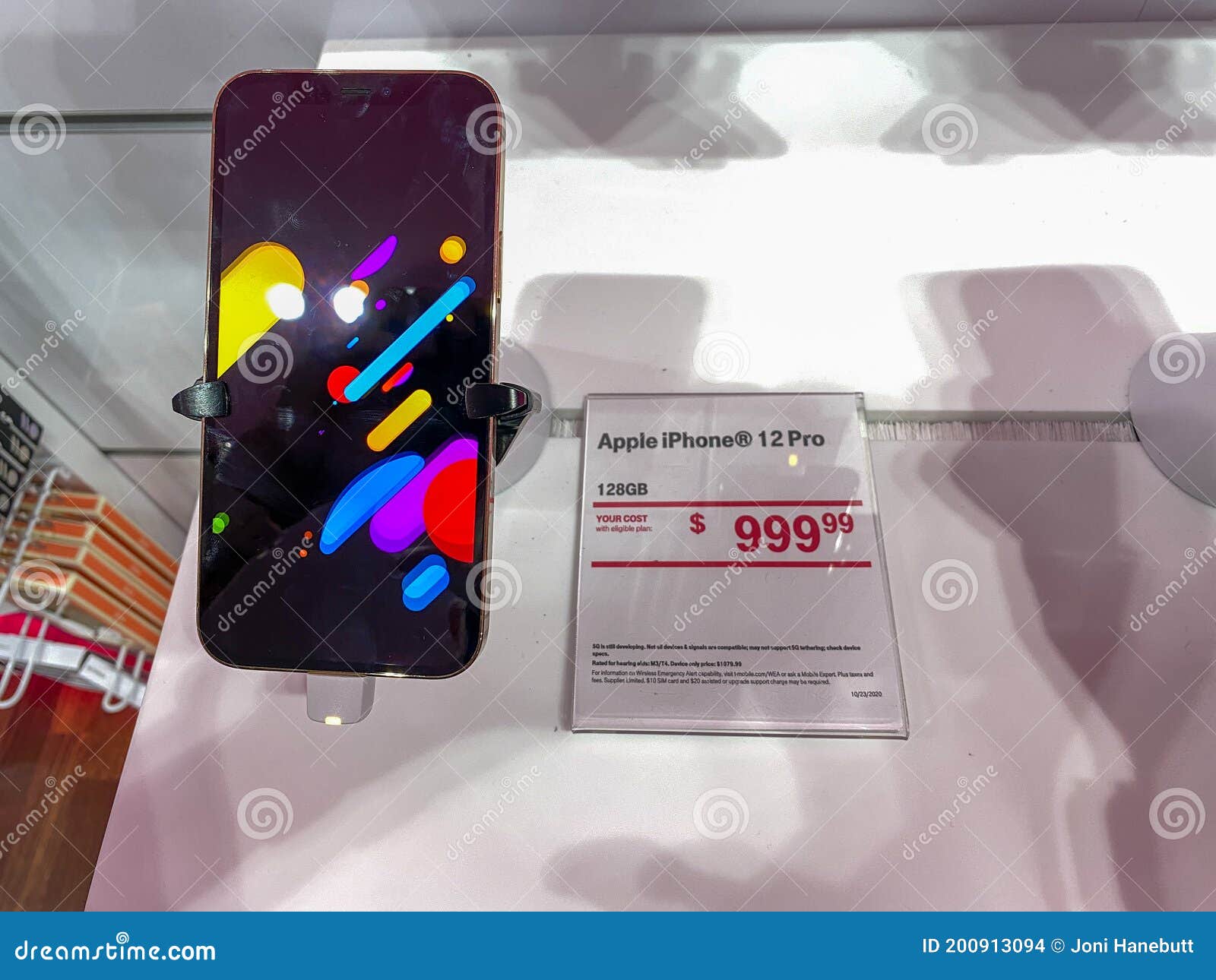 The New Apple IPhone 12 and 12 Pro on Display at the T Mobile Store ...