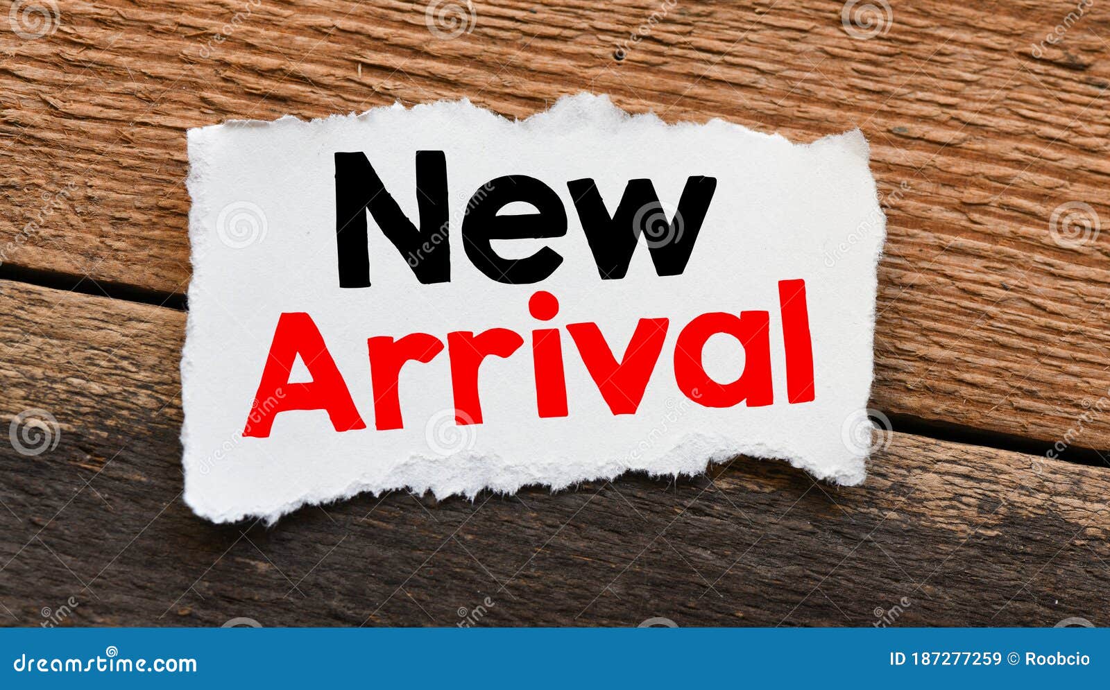 New Arrival Text Written on a White Sheet and Wooden Table Stock Image ...