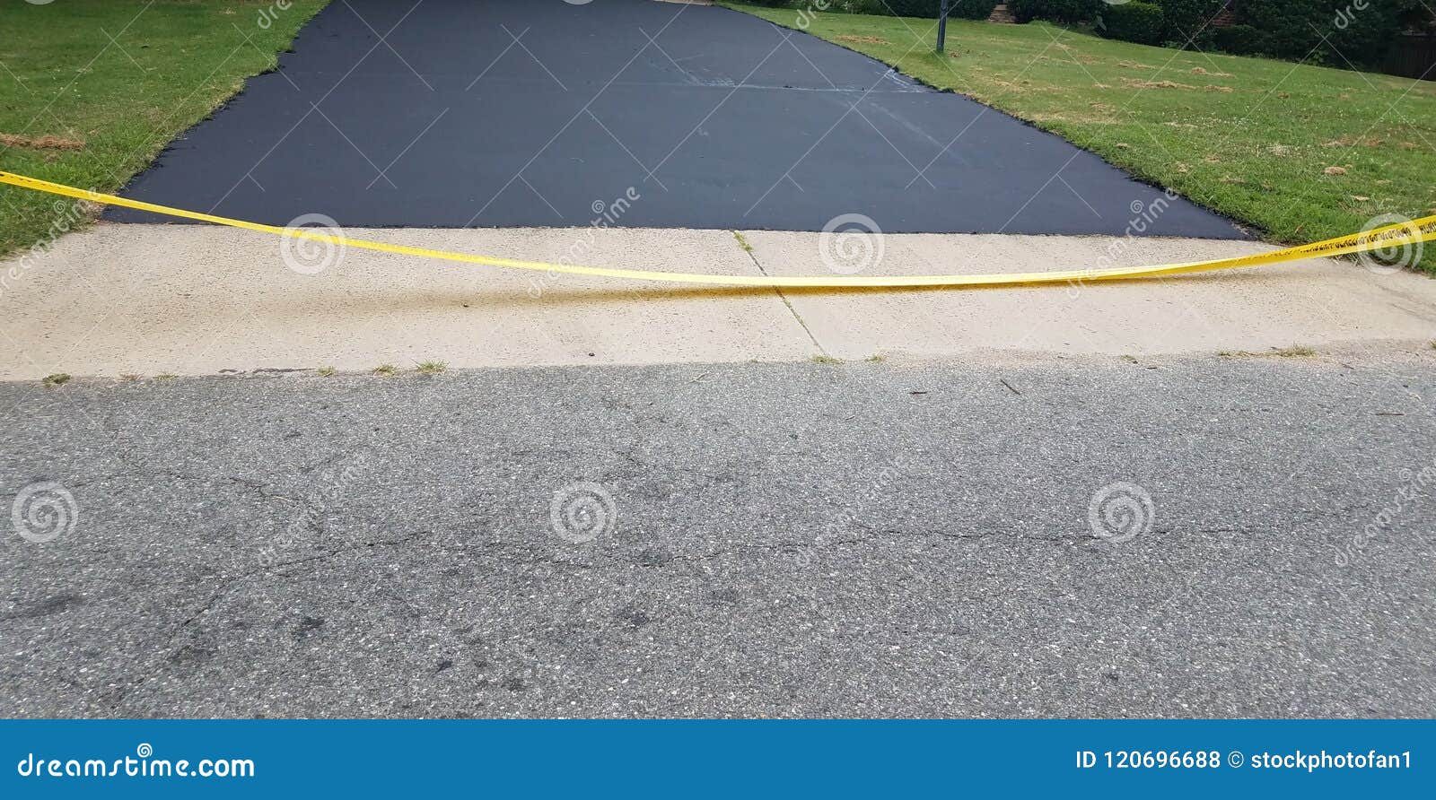 New Asphalt Driveway and Yellow Caution Tape Stock Photo - Image of ...