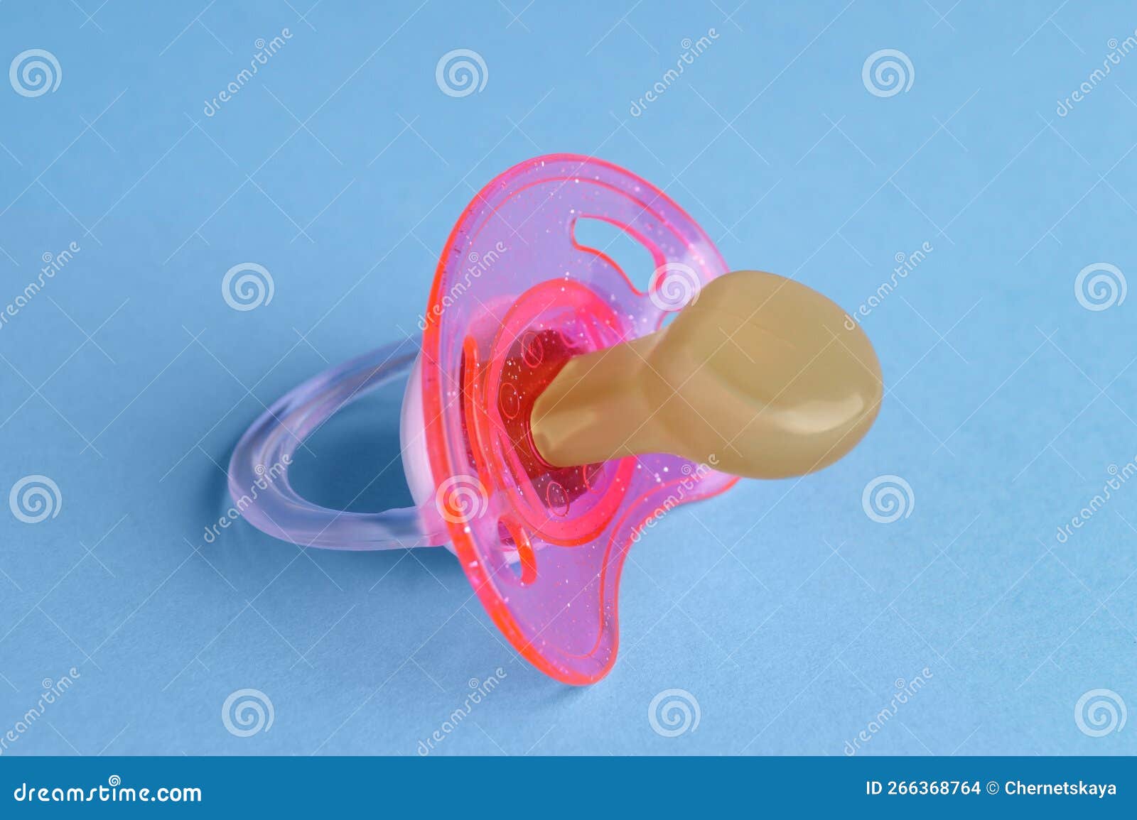 New Baby Pacifier on Light Blue Background, Closeup Stock Photo - Image ...