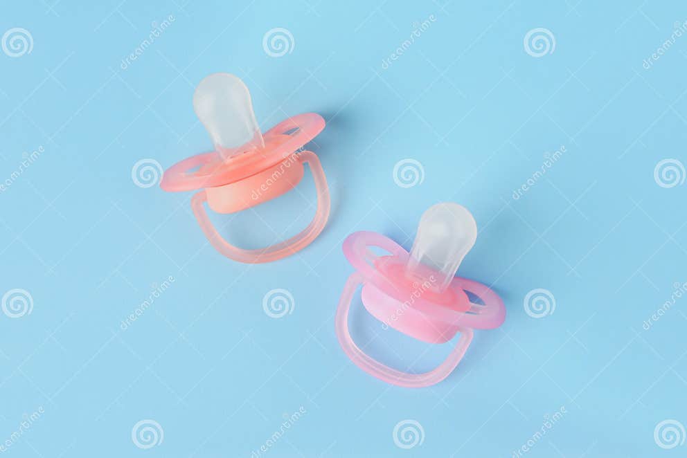 New Baby Pacifiers on Light Blue Background, Flat Lay Stock Photo ...