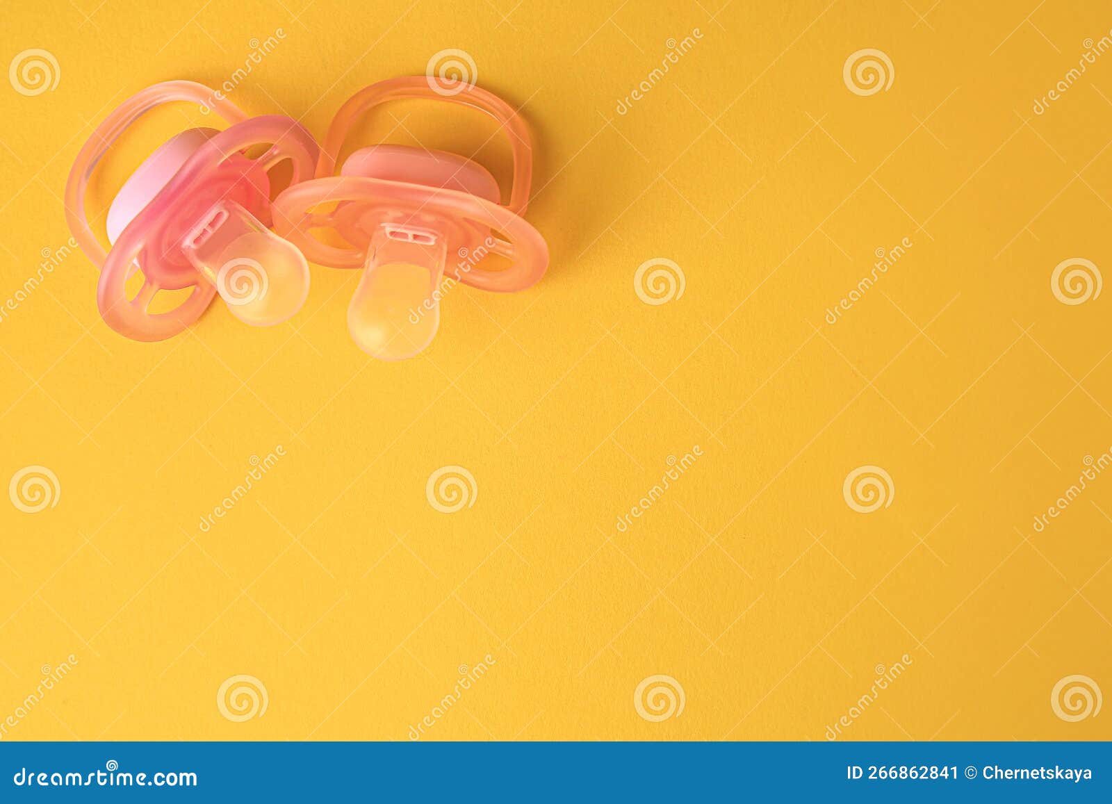 New Baby Pacifiers on Orange Background, Flat Lay. Space for Text Stock ...