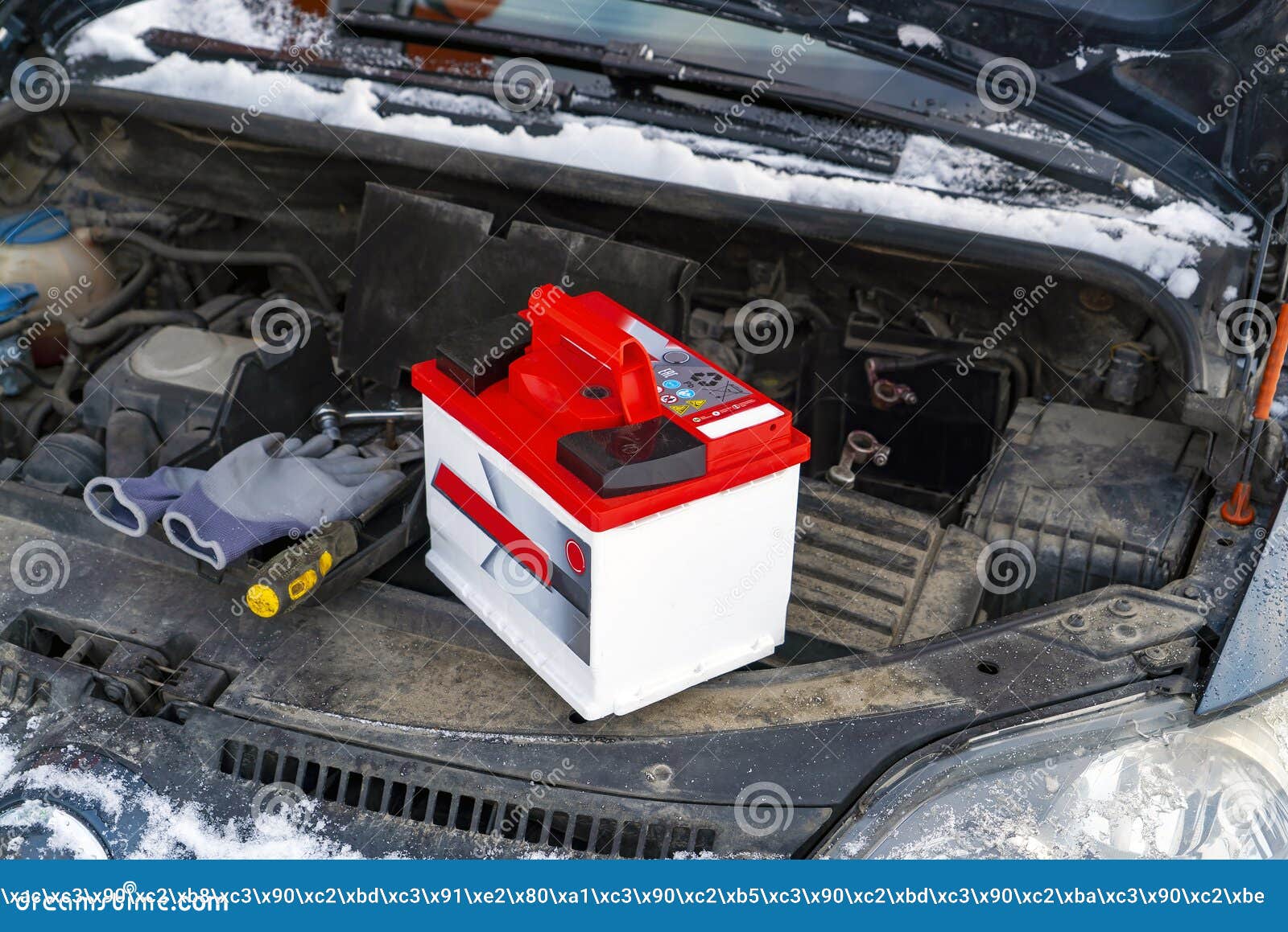 A New Battery in the Engine Compartment of the Car in Winter. Stock ...