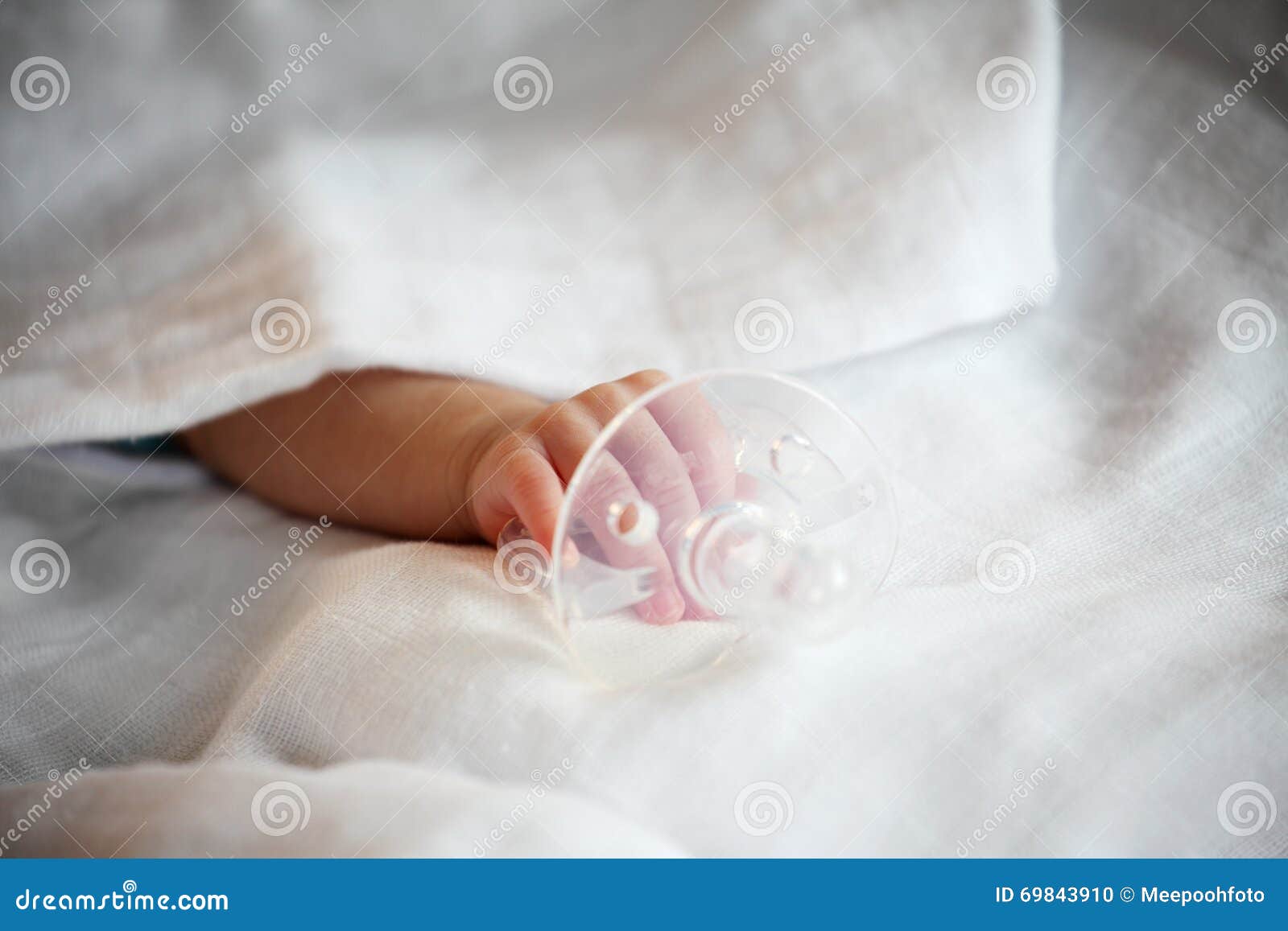 New Born Baby Hand Holding Pacifier Stock Photo - Image of nibble ...