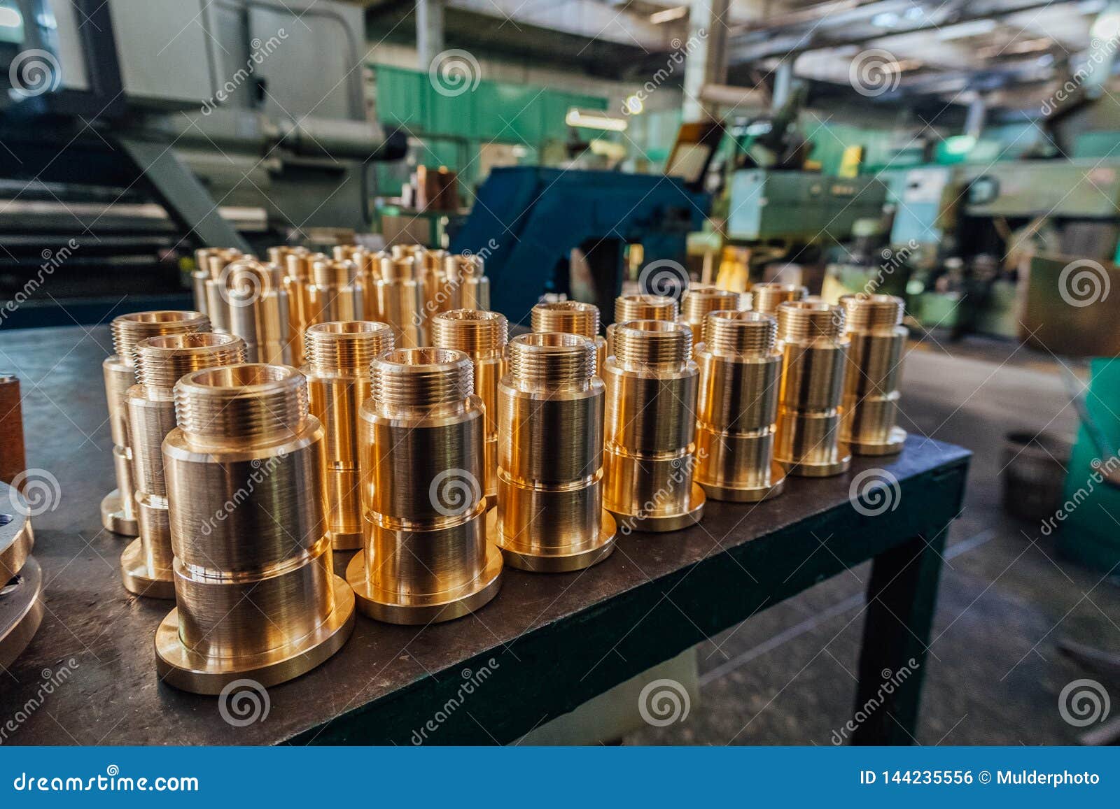 New Brass Threaded Bushings on Table in Factory Stock Photo - Image of ...