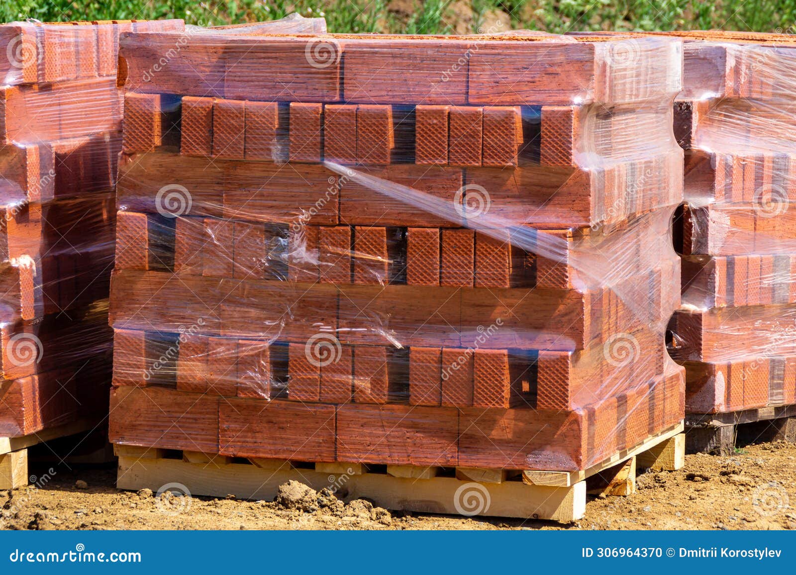 New Bricks Packed in a Pallet Standing on a Clay Surface of a ...