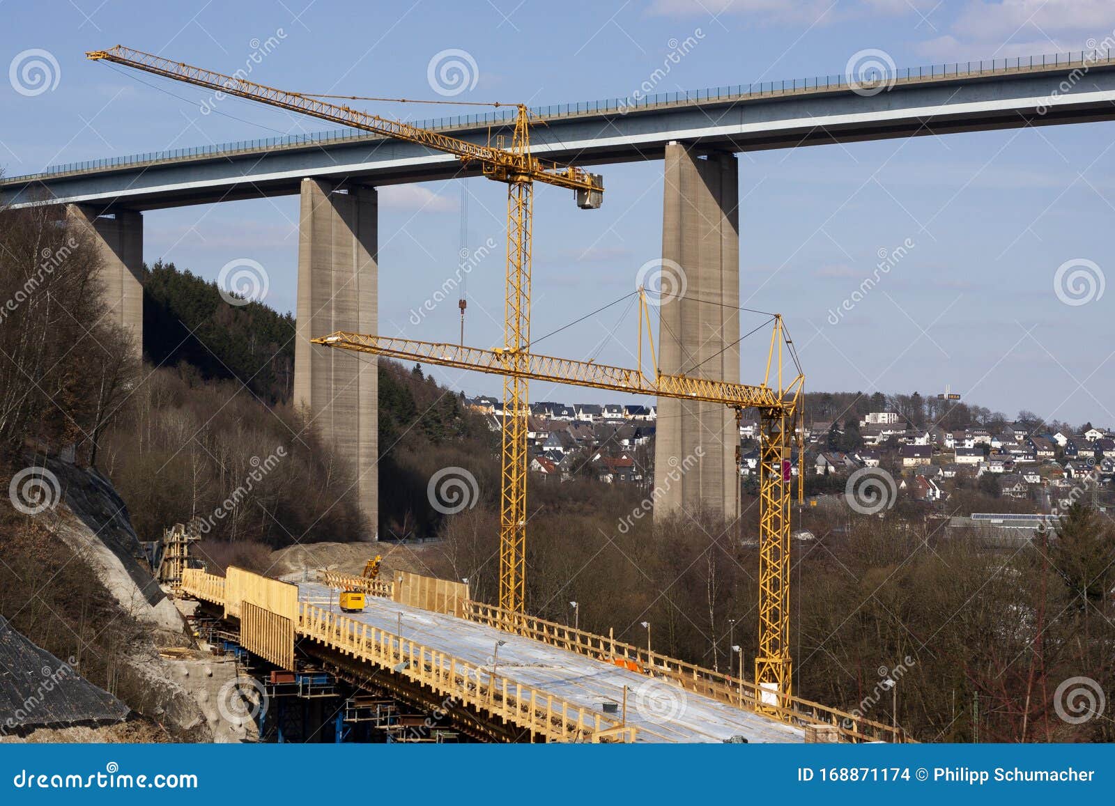 A New Bridge Under Construction in the Background a Highway Bridge ...