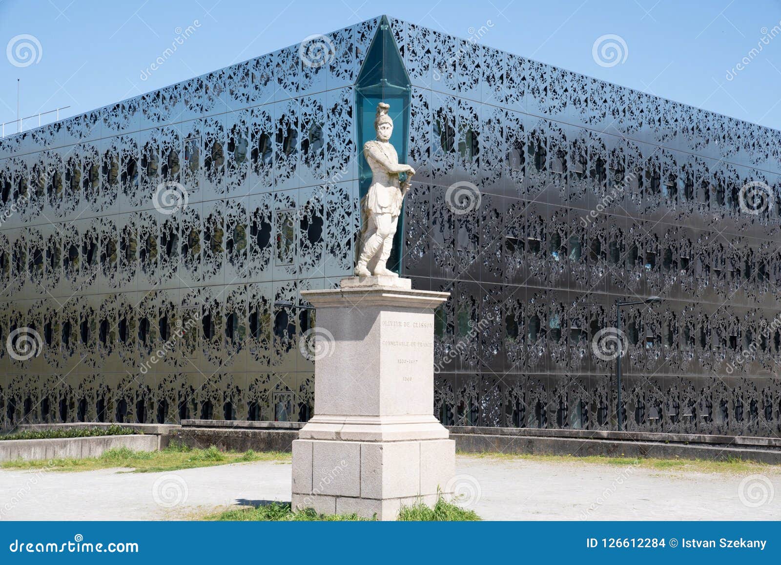 New Building Built on a Modern Architecture with an Old Statue in Front ...
