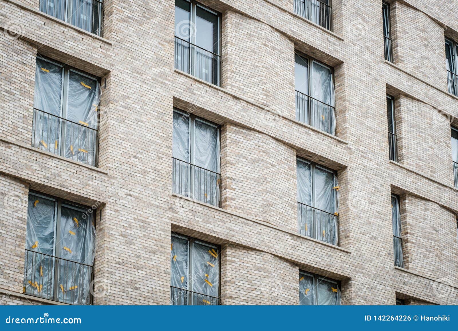 New Building Facade with Covered Windows - Vacant Apartments Stock ...