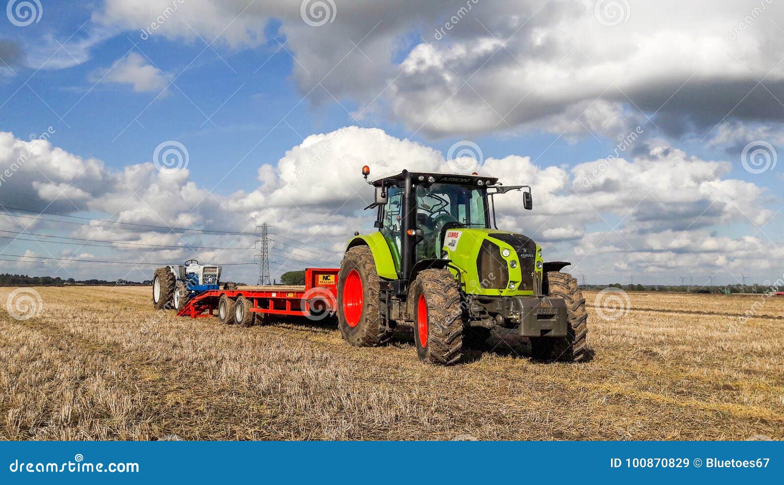 A Claas 630 Tractor Pulling a Trailer To Load Vintage Tractor Editorial ...