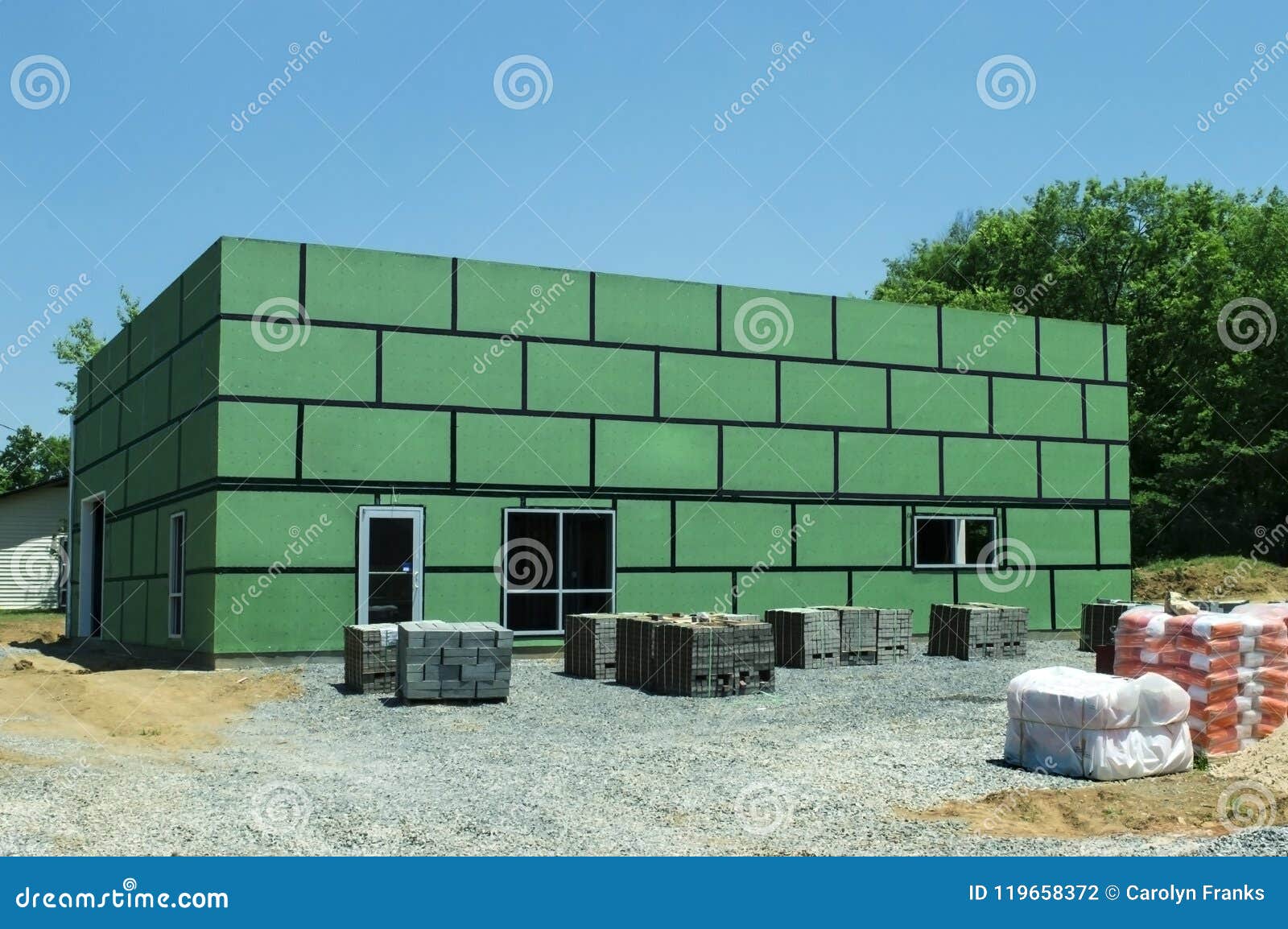 New Construction on a Building with Green Insulation Stock Photo ...